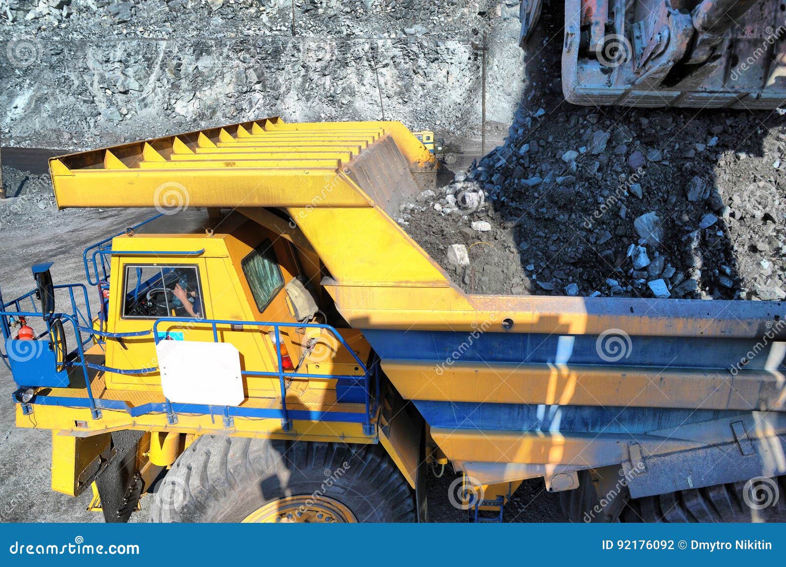 Excavator Loading Iron Ore into Heavy Dump Trucks Stock Photo - Image ...