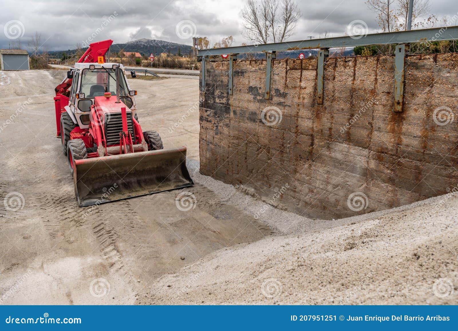 Excavator Loading Salt for Road Treatment in Winter Stock Image - Image ...
