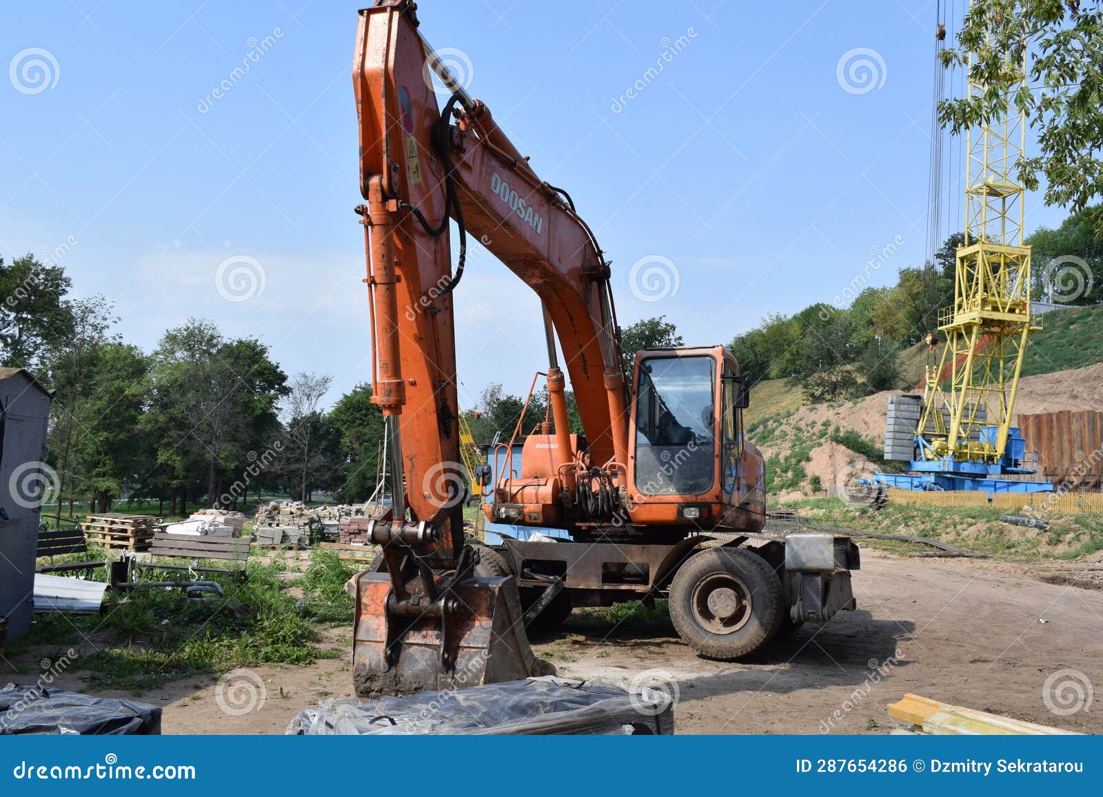 Excavator Loading Sand into the Back of a Truck Stock Photo - Image of ...