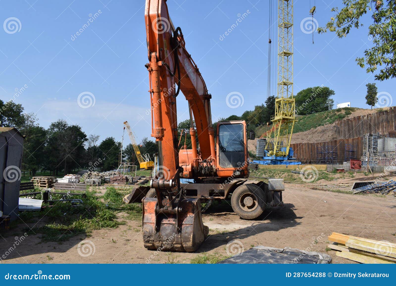 Excavator Loading Sand into the Back of a Truck Stock Photo - Image of ...