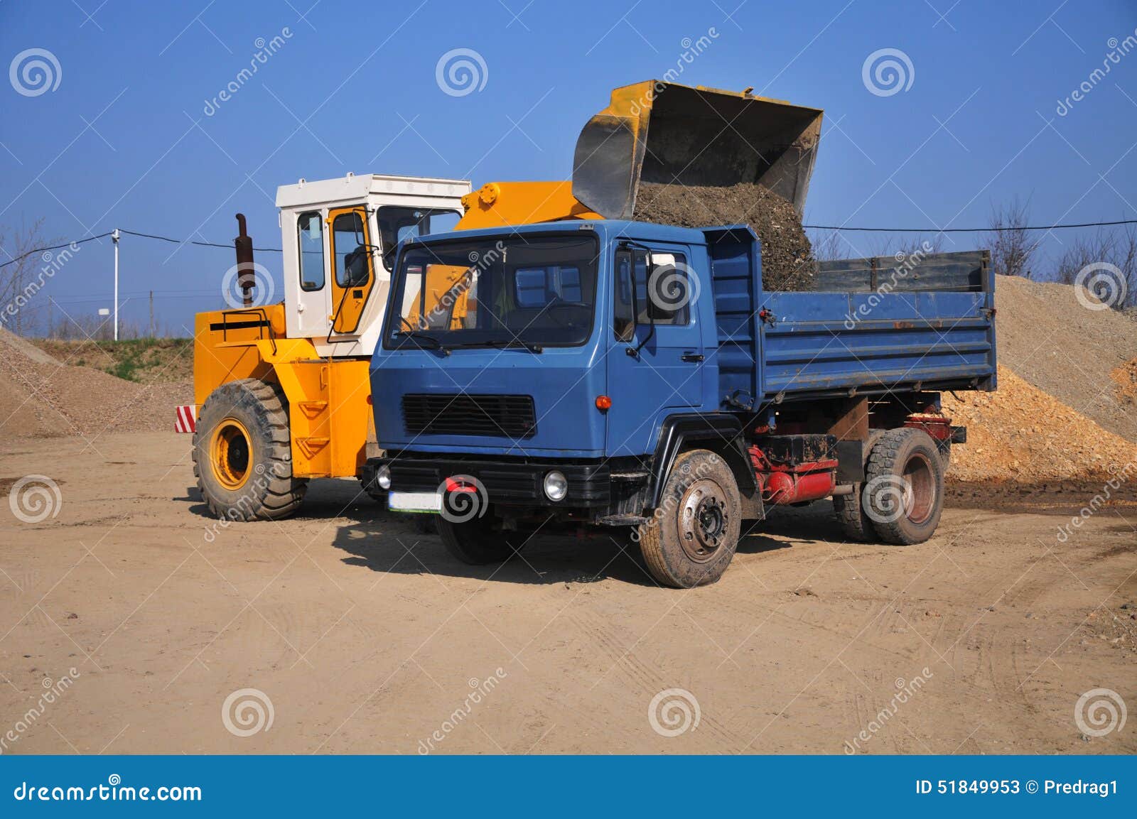 Excavator Loading Soil into a Dumper Truck Stock Image - Image of ...