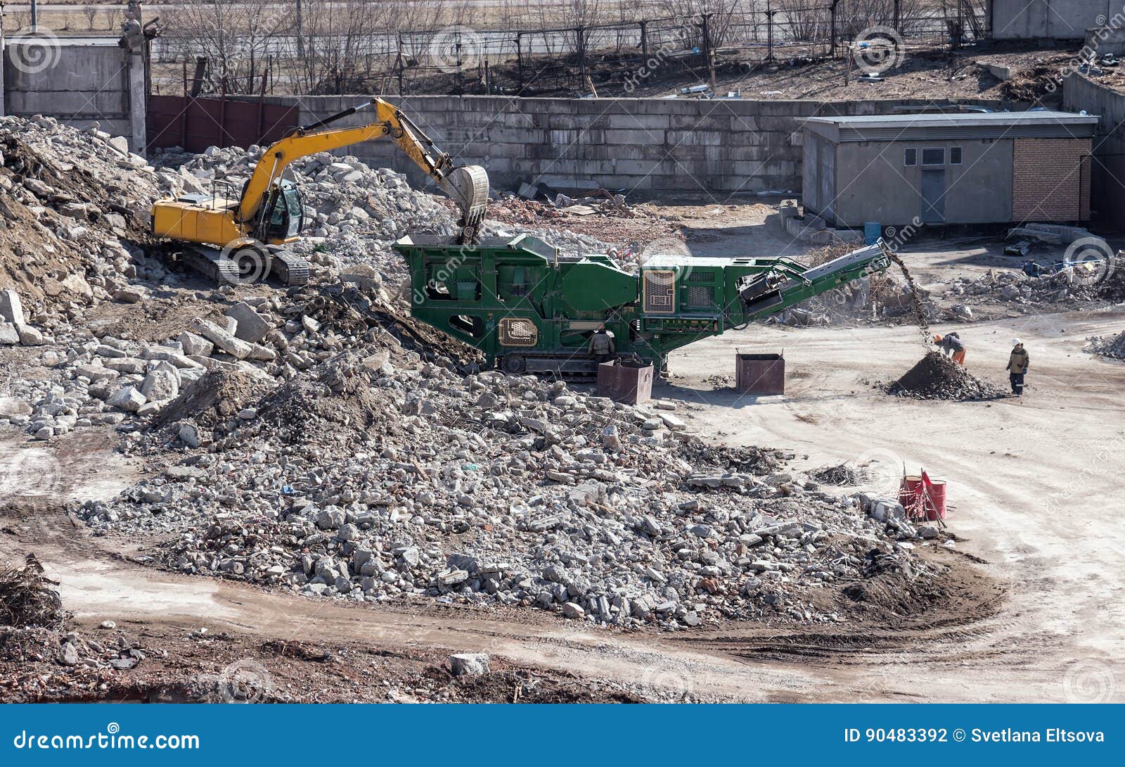 Excavator Loading Soil into Mobile Rock Crusher Stock Photo - Image of ...
