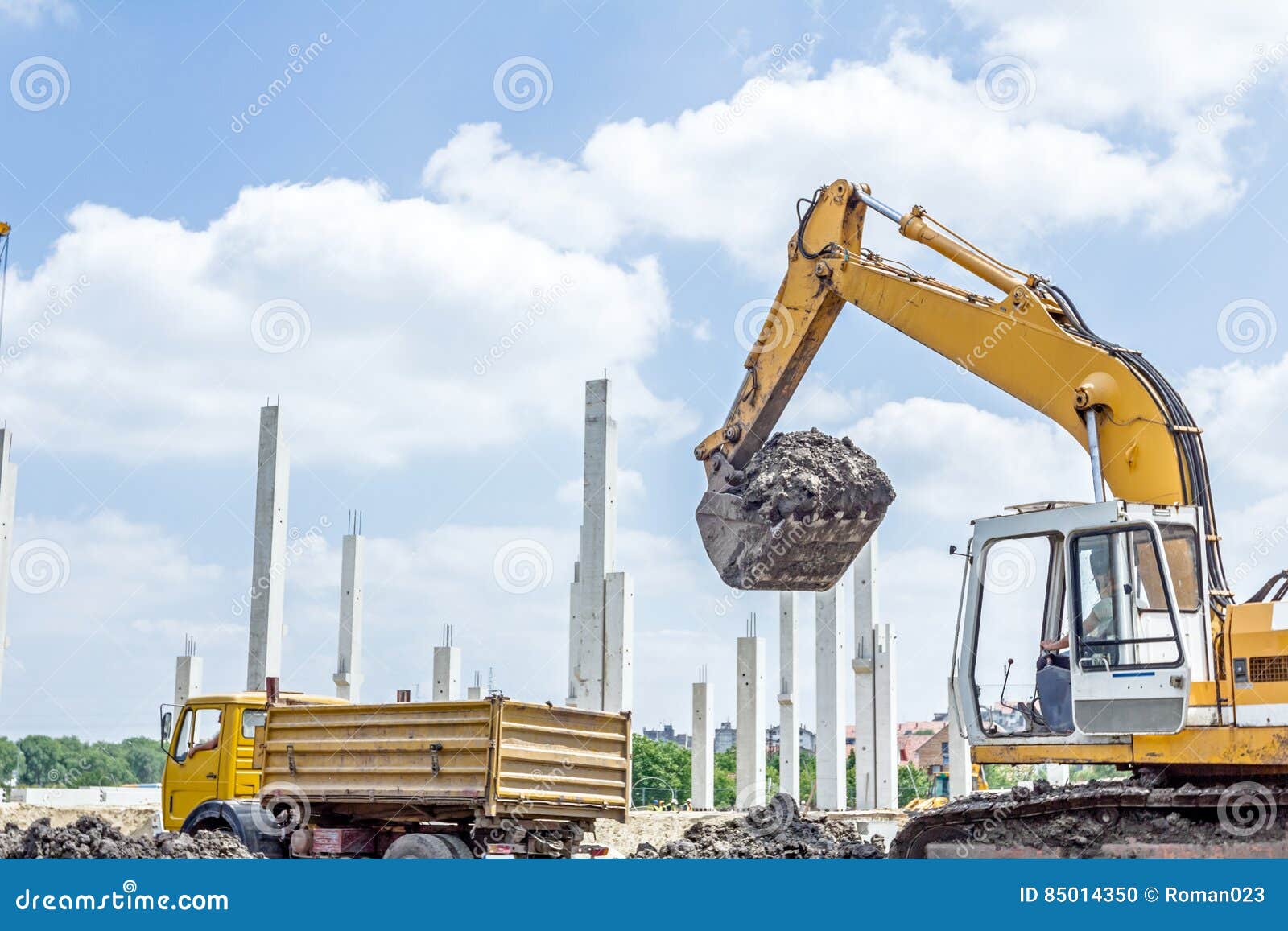 Excavator is Loading a Truck on Building Site Stock Photo - Image of ...