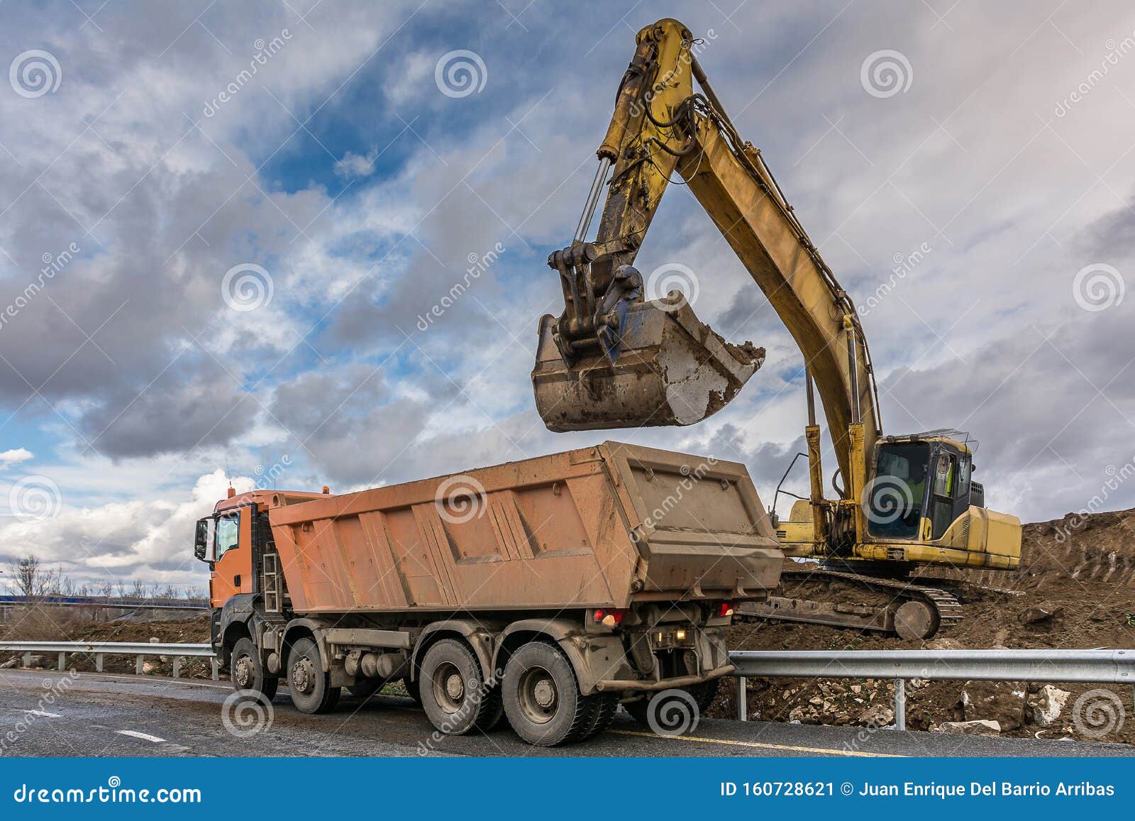 Excavator Loading a Truck at Construction Sites Stock Image - Image of ...