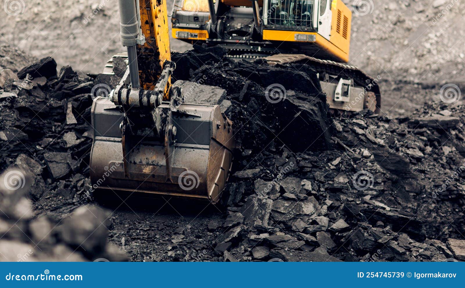 Excavator Loads Coal into the Back of a Heavy Mining Dump Truck. Stock ...