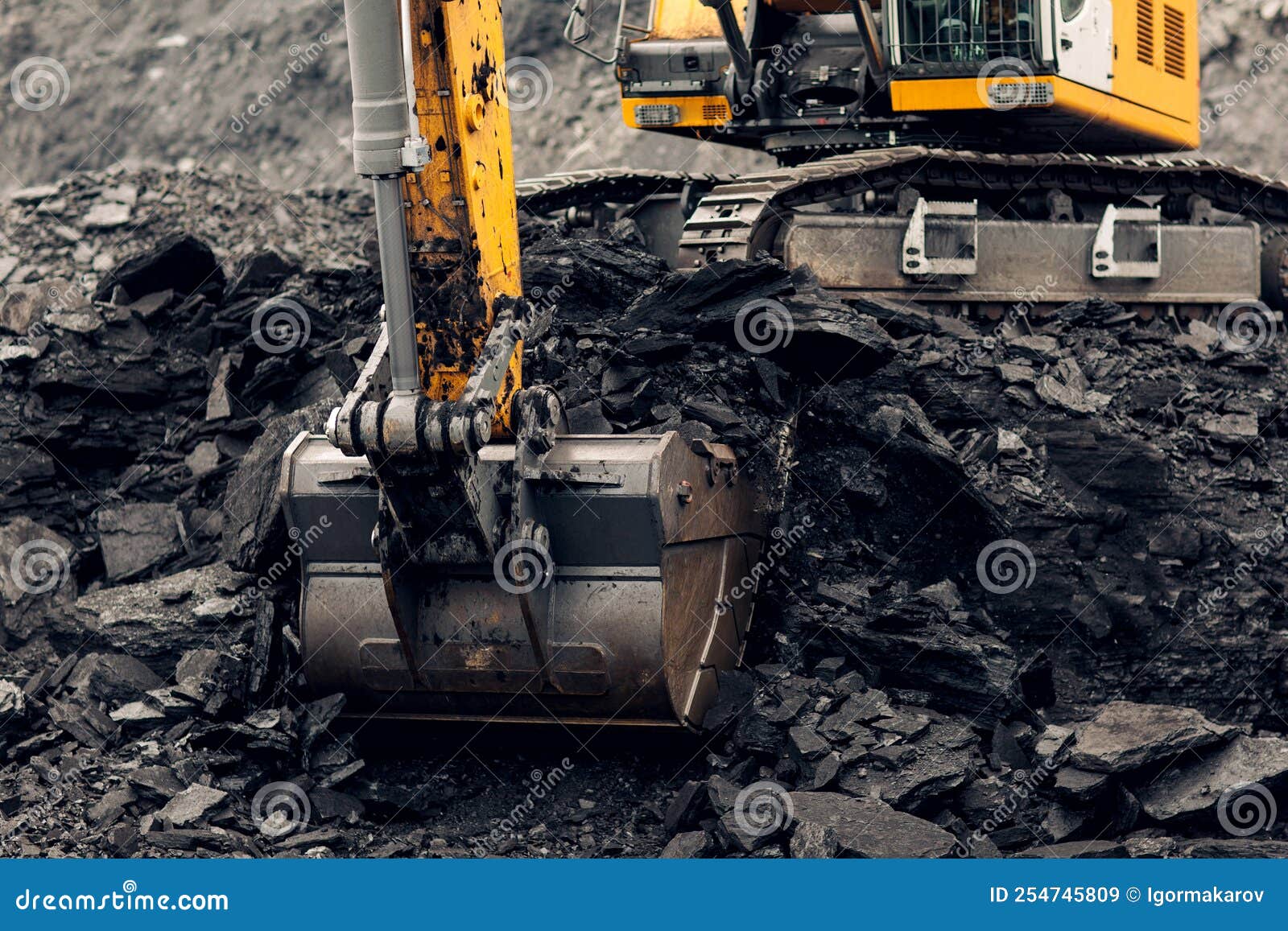 Excavator Loads Coal into the Back of a Heavy Mining Dump Truck. Stock ...