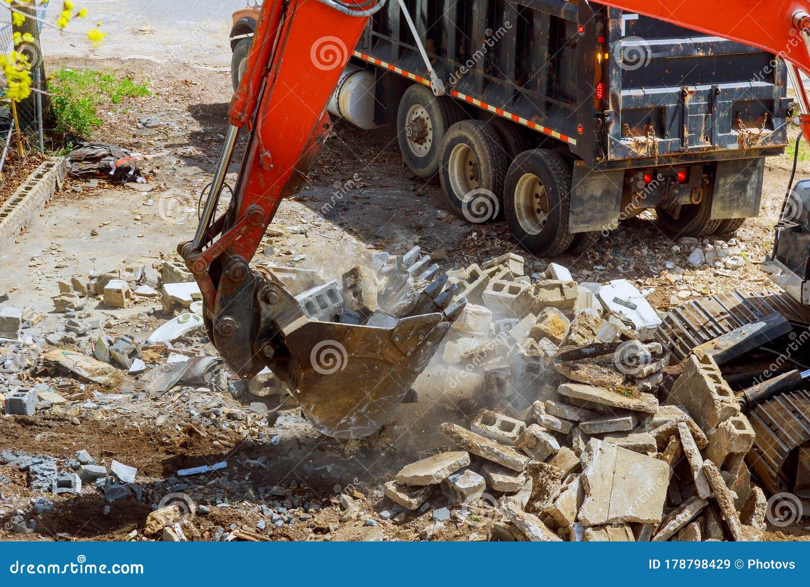 Excavator Loads Construction Waste into of Material for Disposal from ...