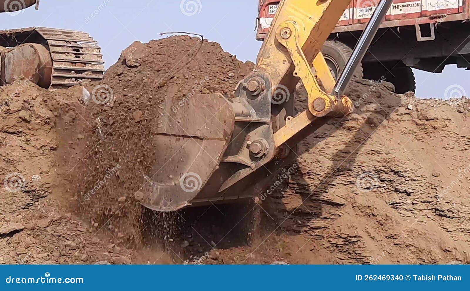 An Excavator Loads Moorum Soil into a Tractor at Construction Land ...