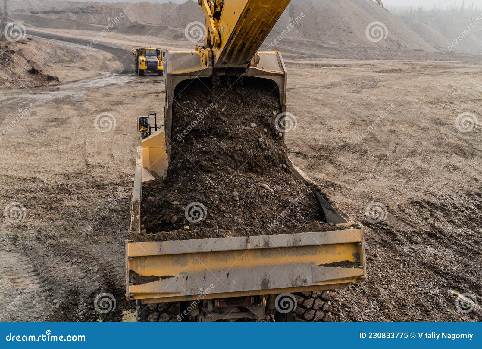 Excavator Loads Ore into a Dump Truck. Stock Image - Image of heavy ...