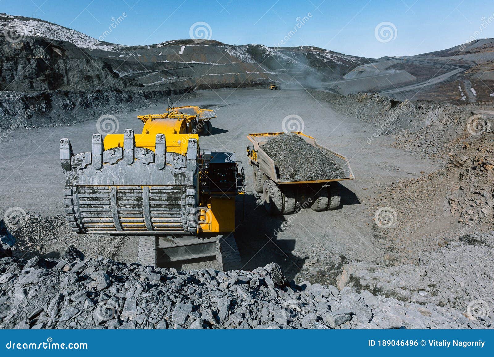 Excavator loads ore stock photo. Image of dump, road - 189046496