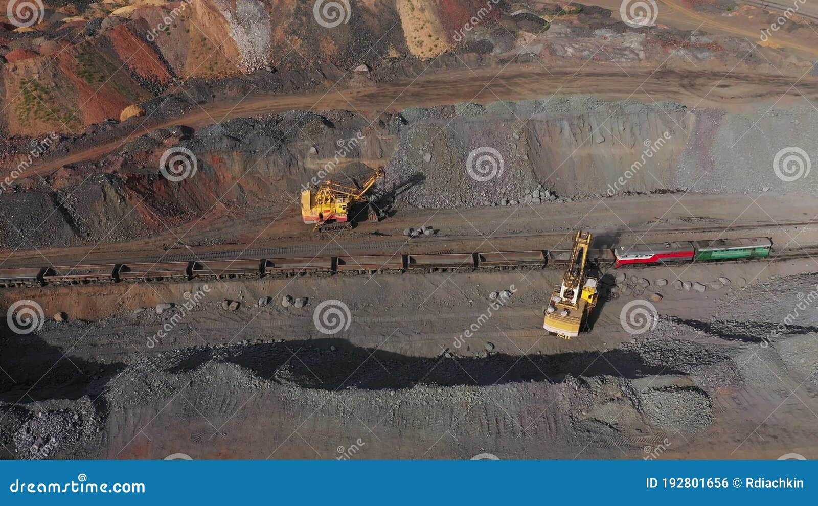 Excavator Loads Ore into a Train Freight Aerial View. Stock Footage ...