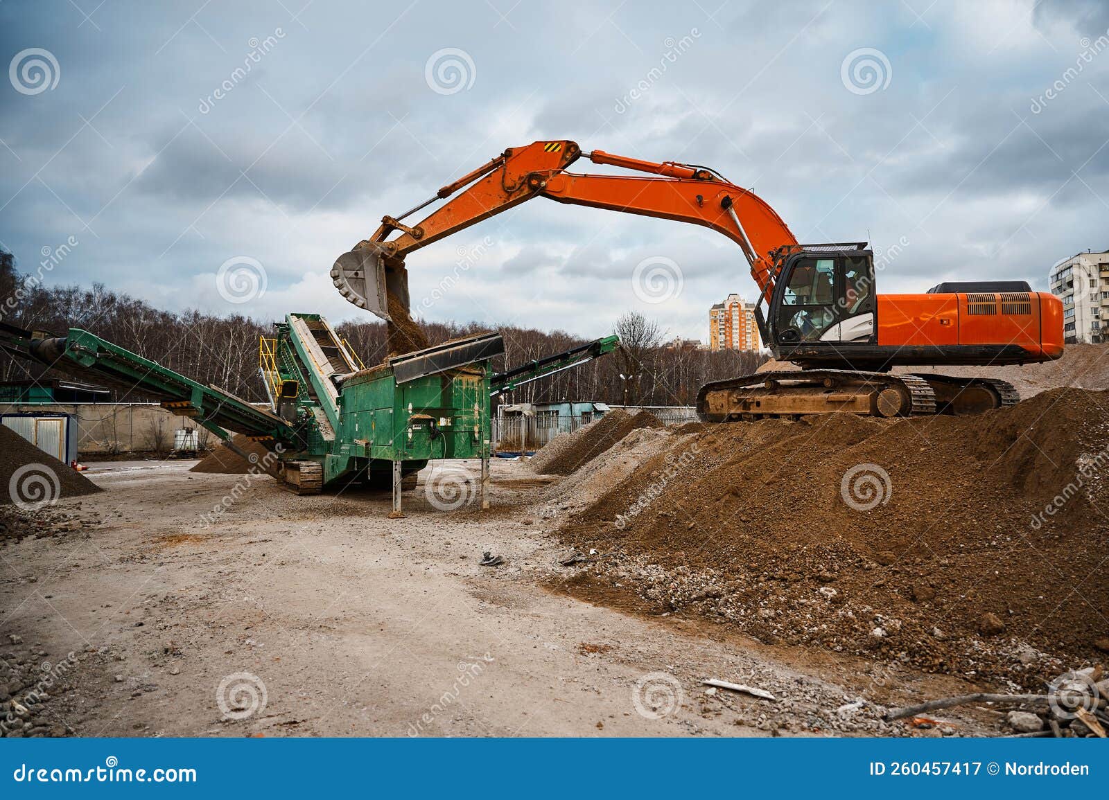 Excavator Loads Soil in Mobile Crushing and Sorting Complex Stock Image ...
