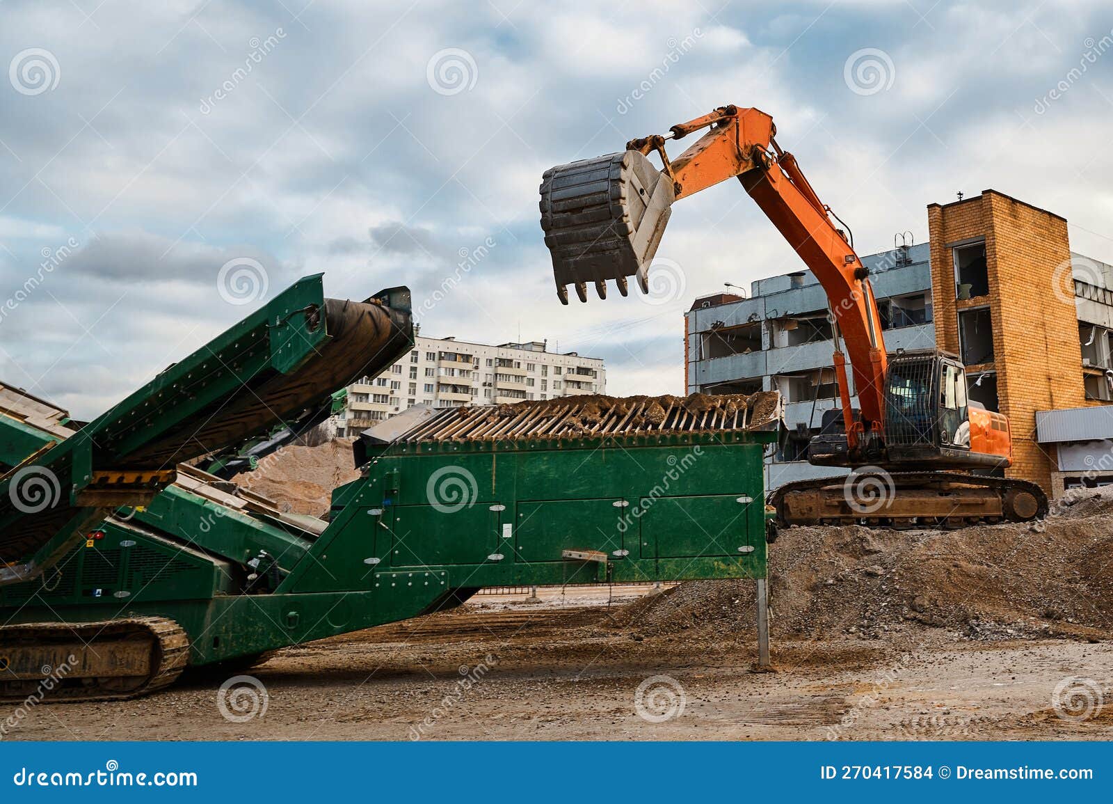 Excavator Loads Soil in Mobile Crushing and Sorting Complex Stock Photo ...