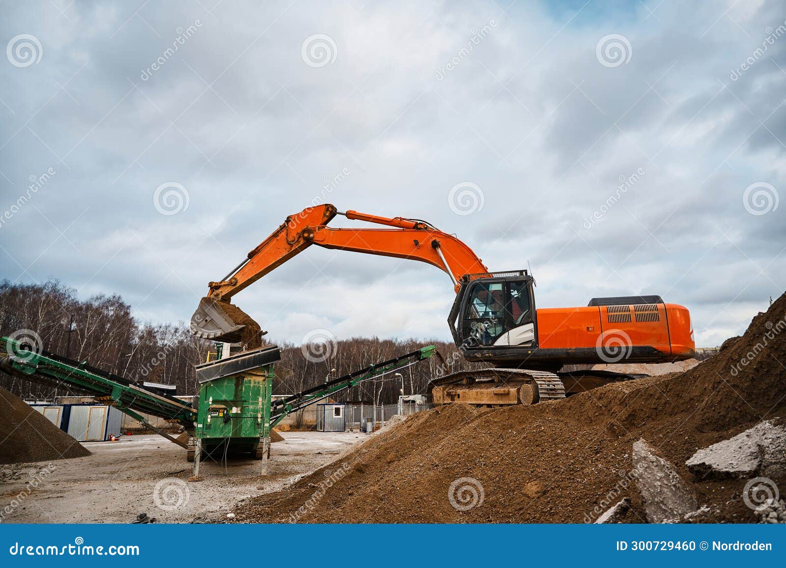 Excavator Loads Soil in Mobile Crushing and Sorting Complex Stock Photo ...