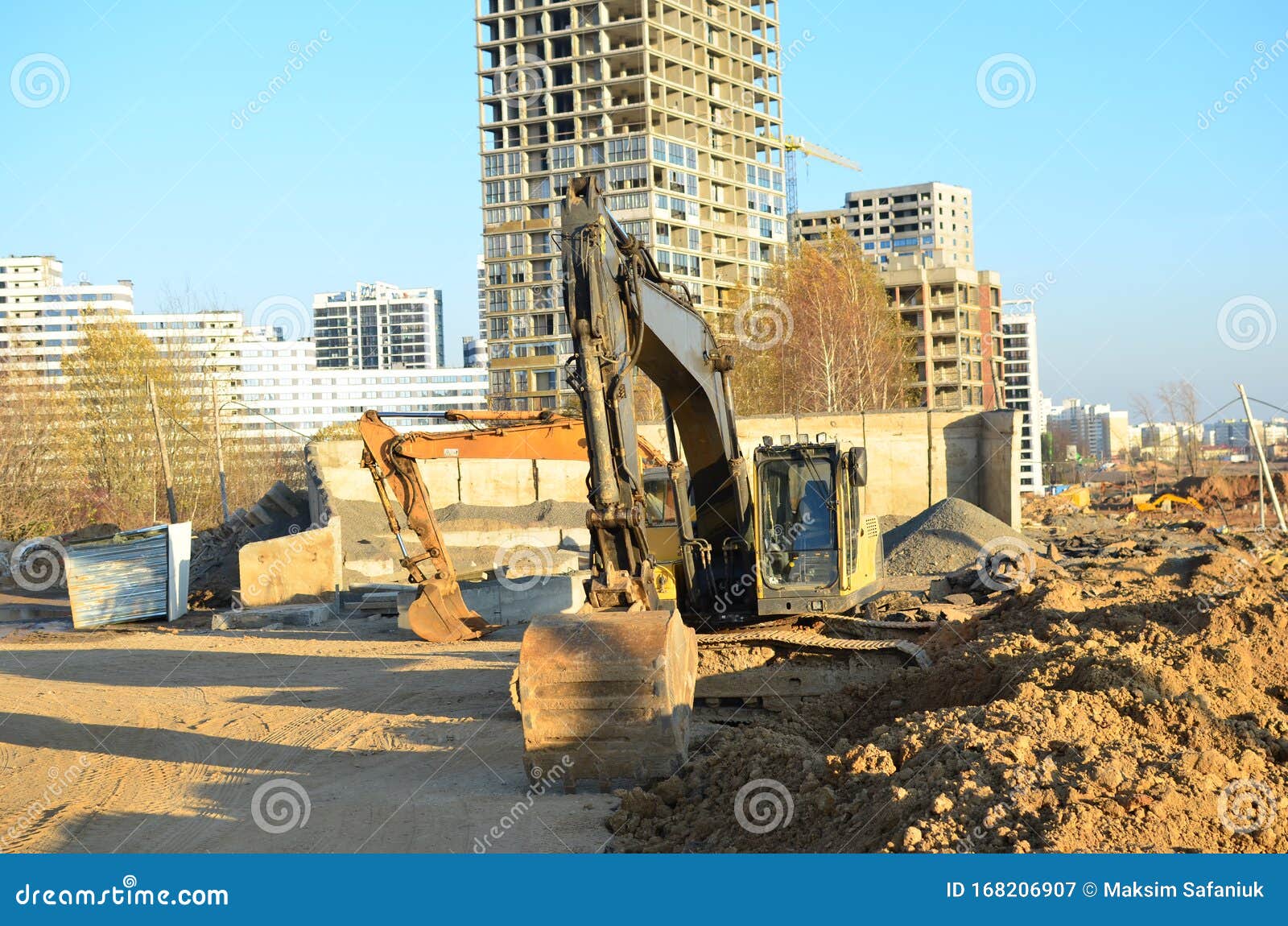 Excavator Loads of Stone and Rubble for Processing into Cement or ...