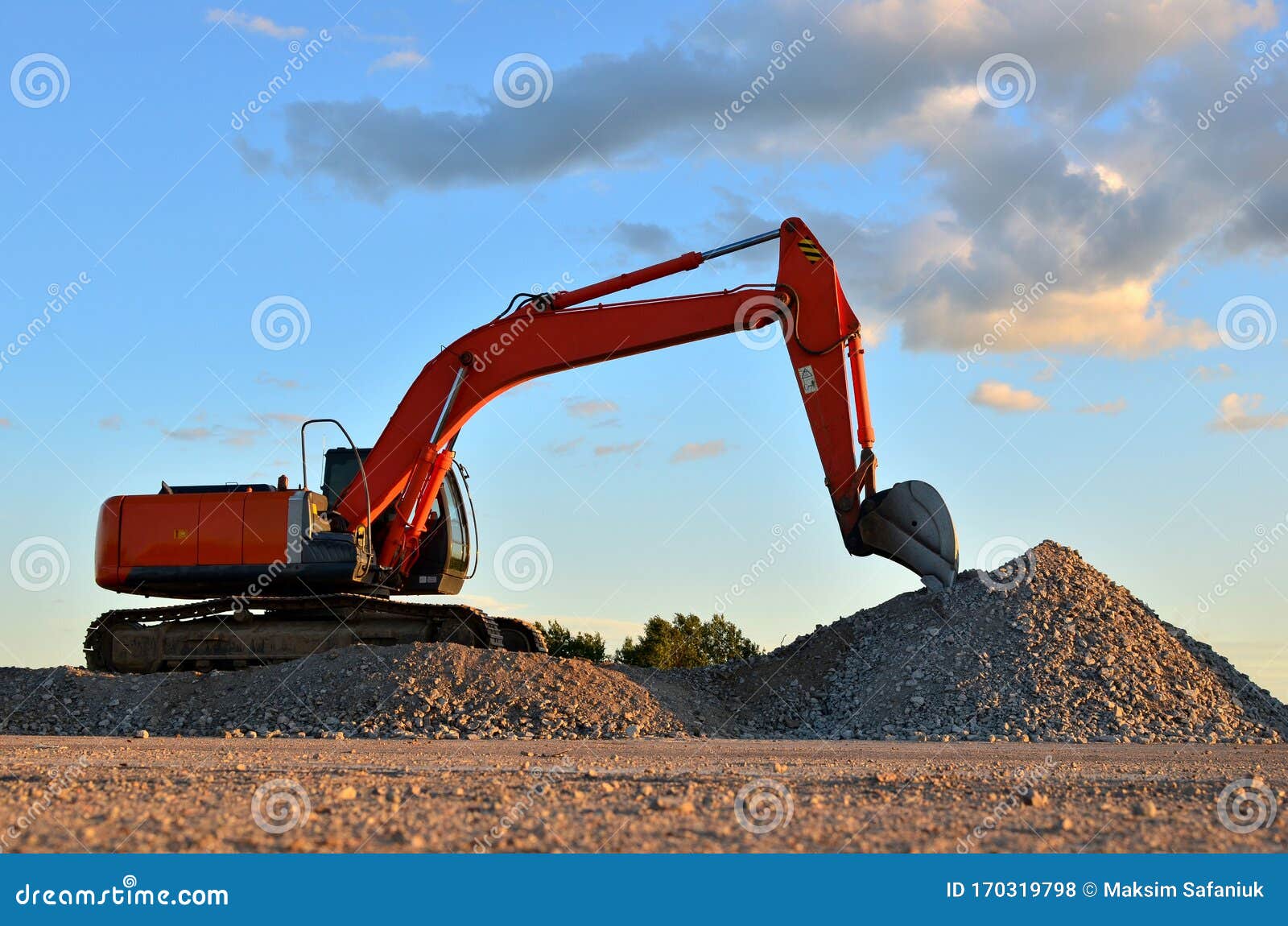 Excavator Loads of Stone and Rubble for Processing into Cement or ...