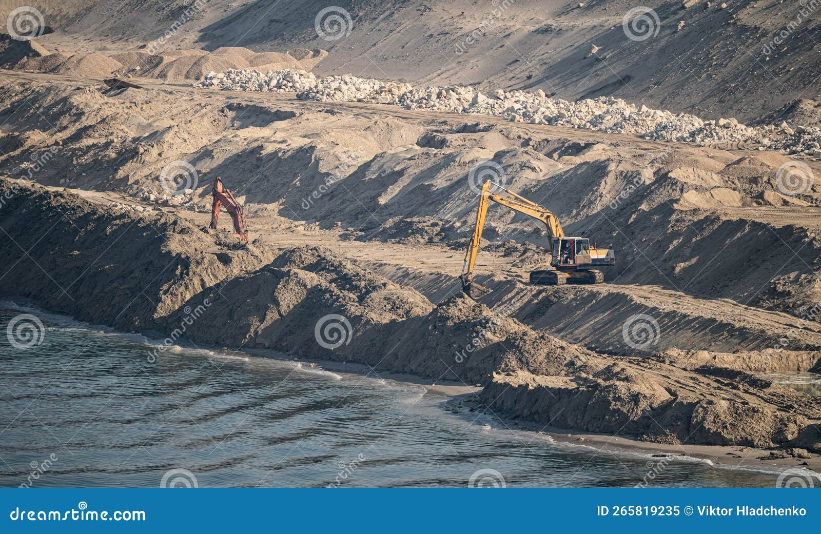 Excavator Machine at Excavation Earthmoving in Sand Quarry by River ...