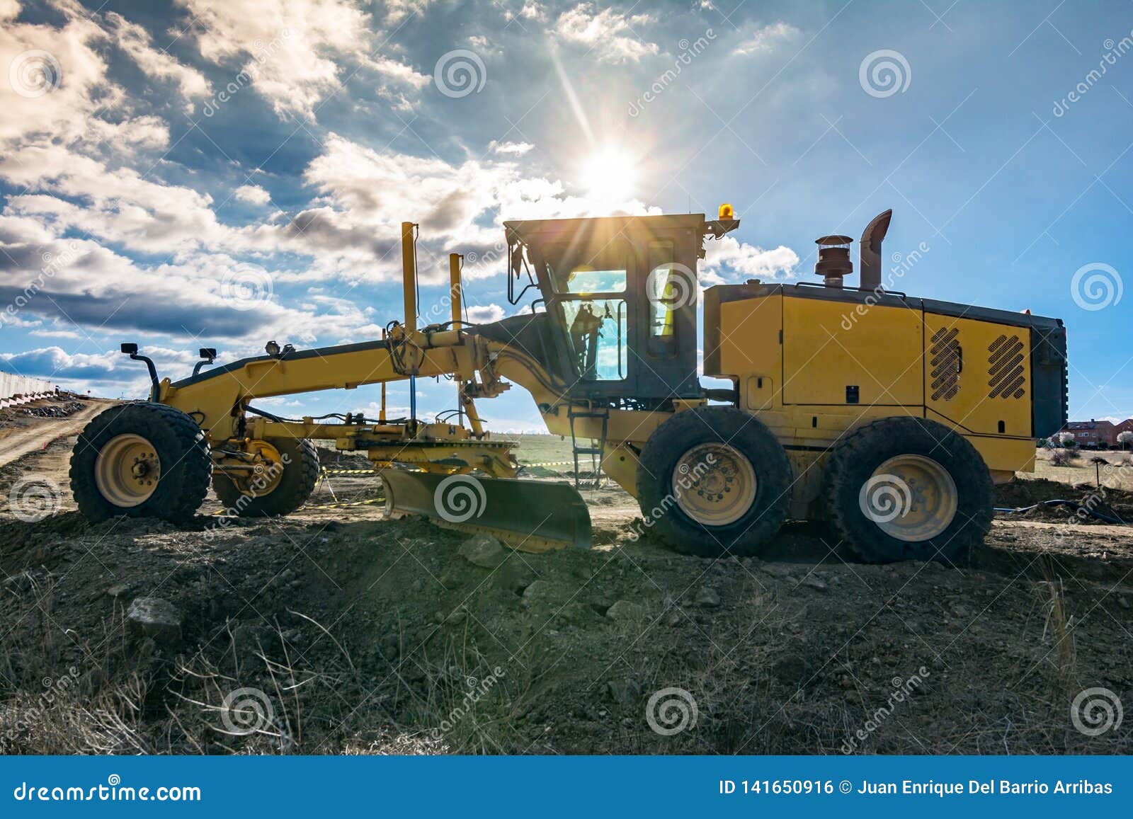 Excavator Machine Leveling the Ground with a Large Shovel Stock Photo ...