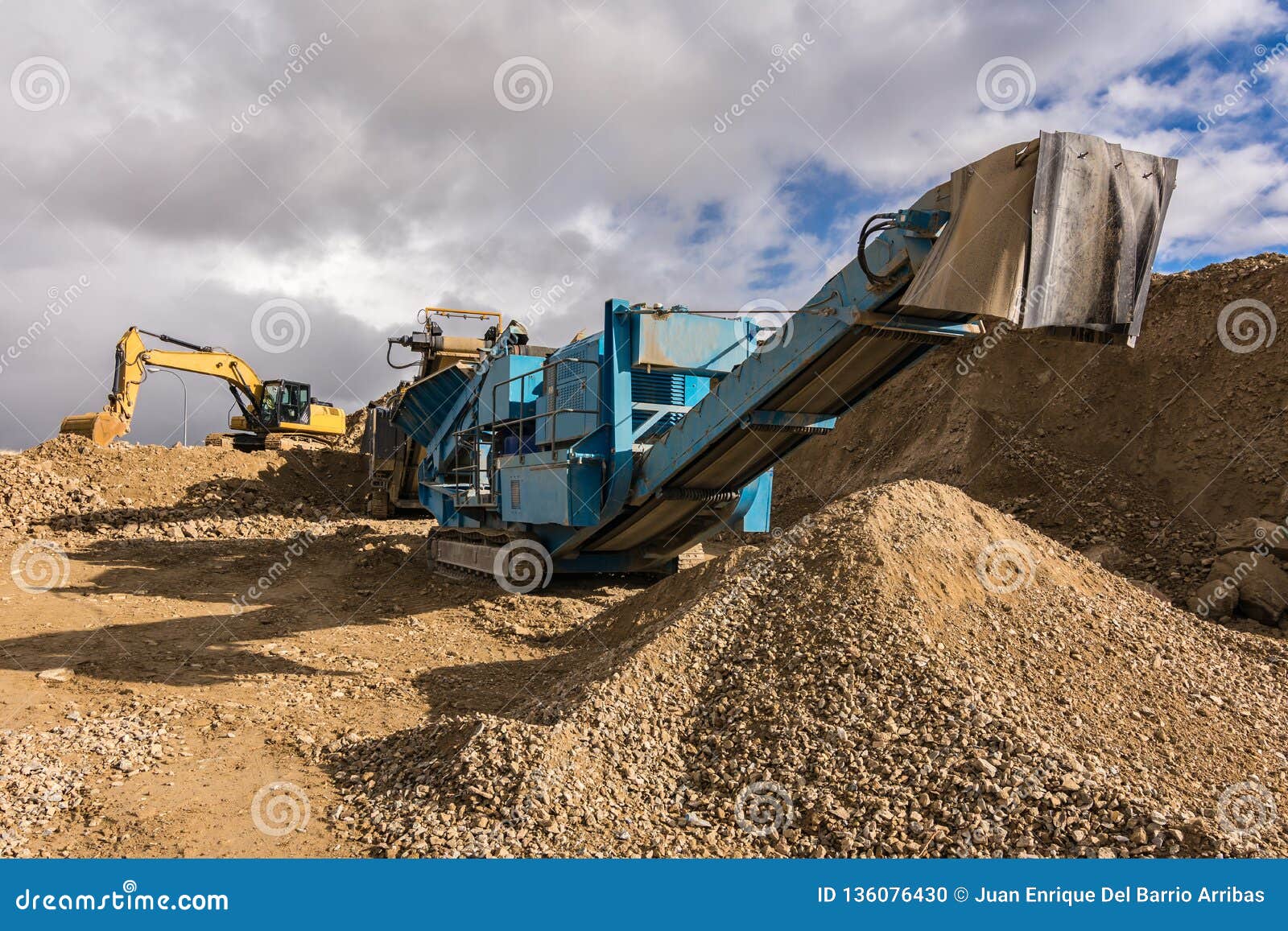 Excavator and Machine To Pulverize Stone in a Quarry Stock Photo ...