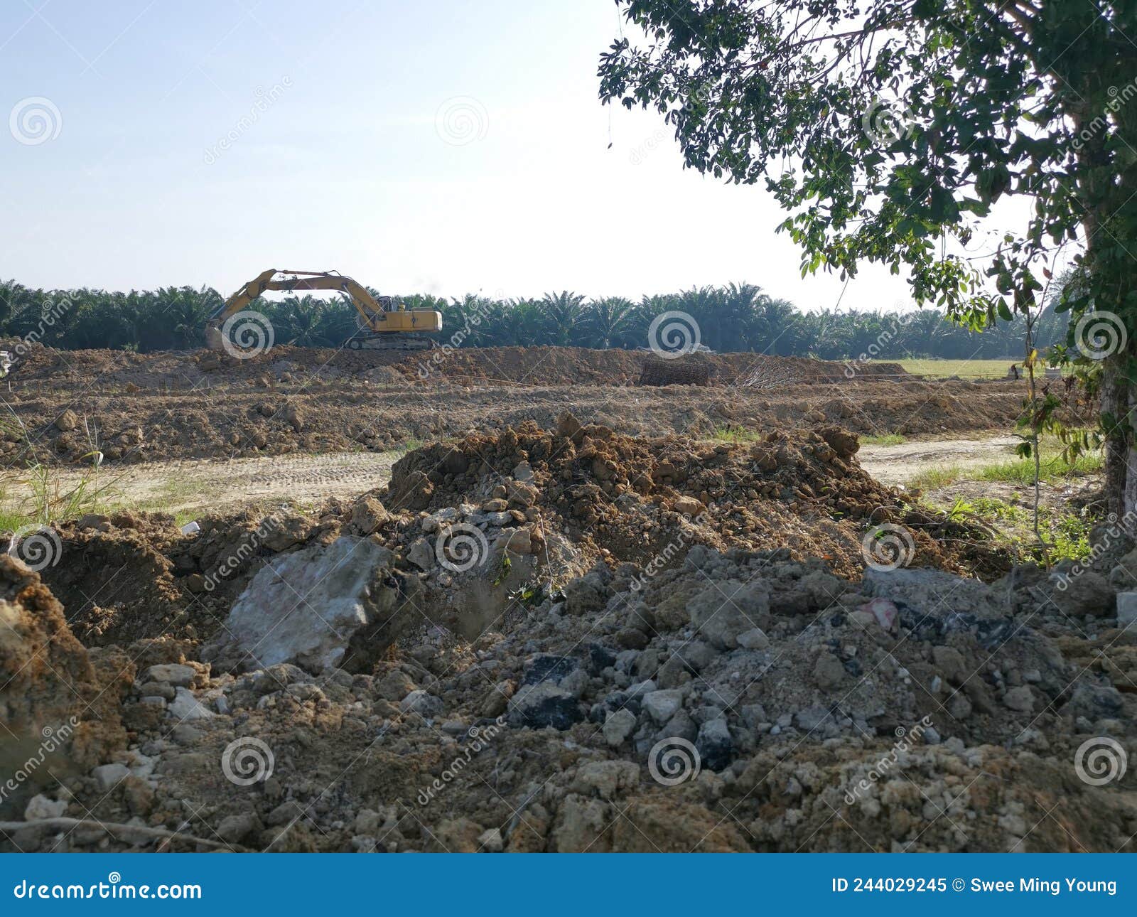 Excavator Machine Working at Construction Site from the Distance Stock ...