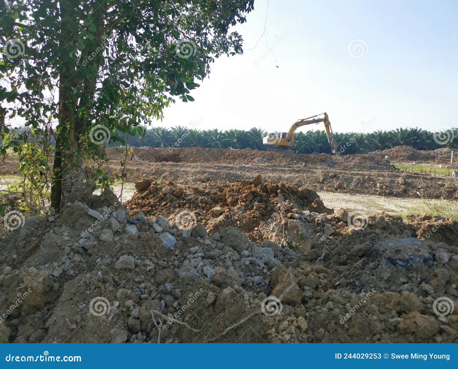 Excavator Machine Working at Construction Site from the Distance Stock ...