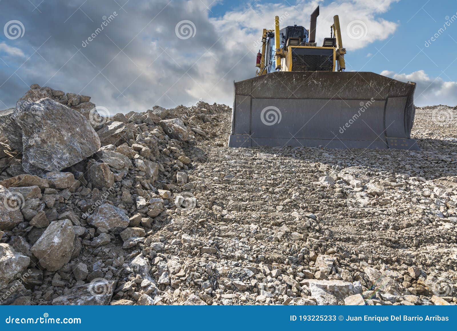 Excavator Making Earth Movements for the Construction of a Road Stock ...