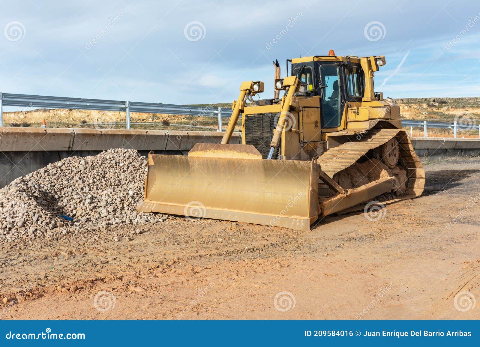 Excavator Making Earth Movements for the Construction of a Road Stock ...
