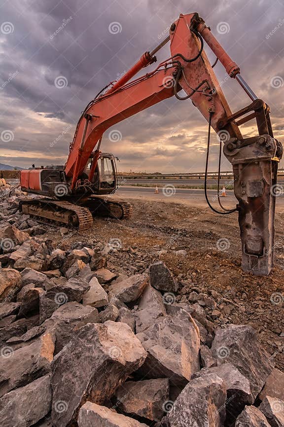 Excavator Making Earth Movements for the Construction of a Road Stock ...