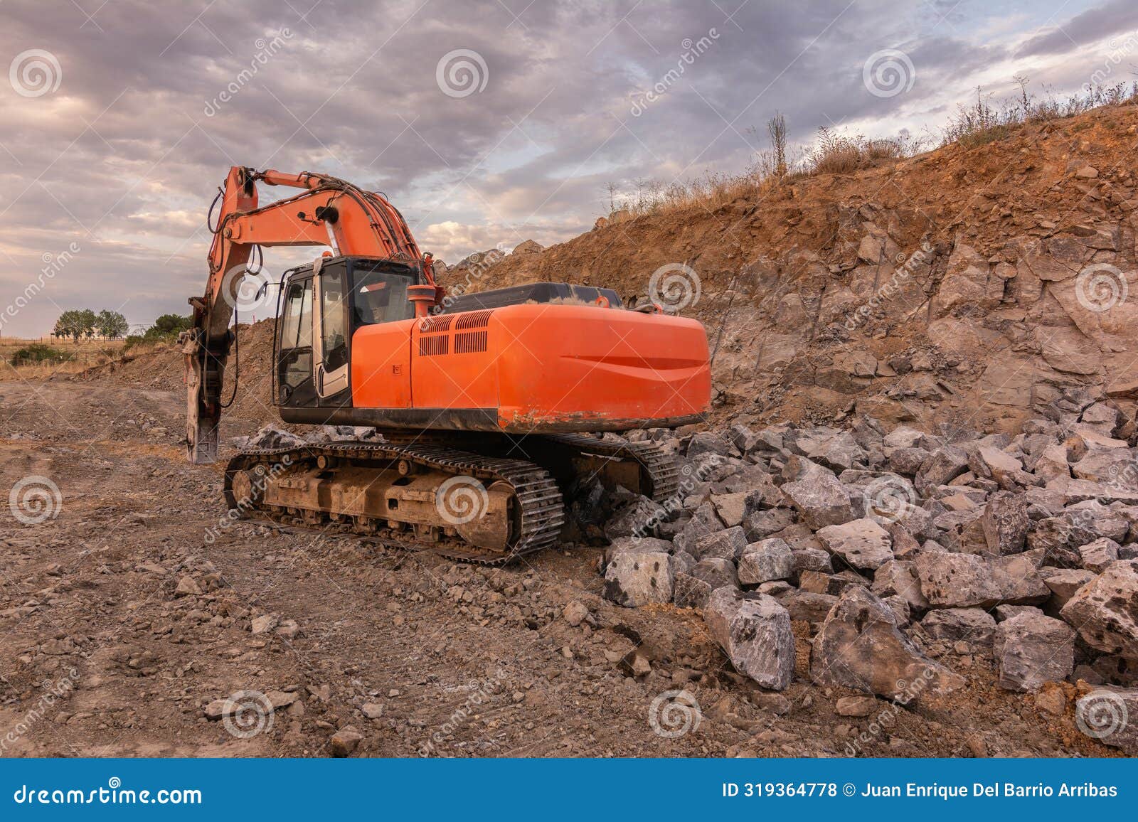 Excavator Making Earth Movements for the Construction of a Road Stock ...