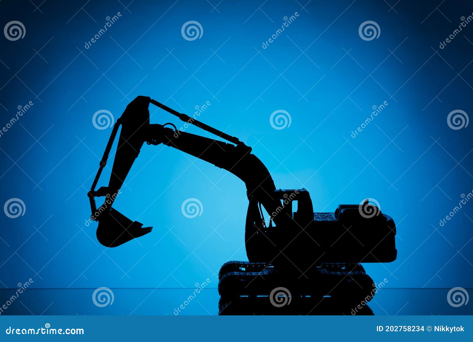 Excavator Model Silhouette on Blue Background Stock Photo - Image of ...
