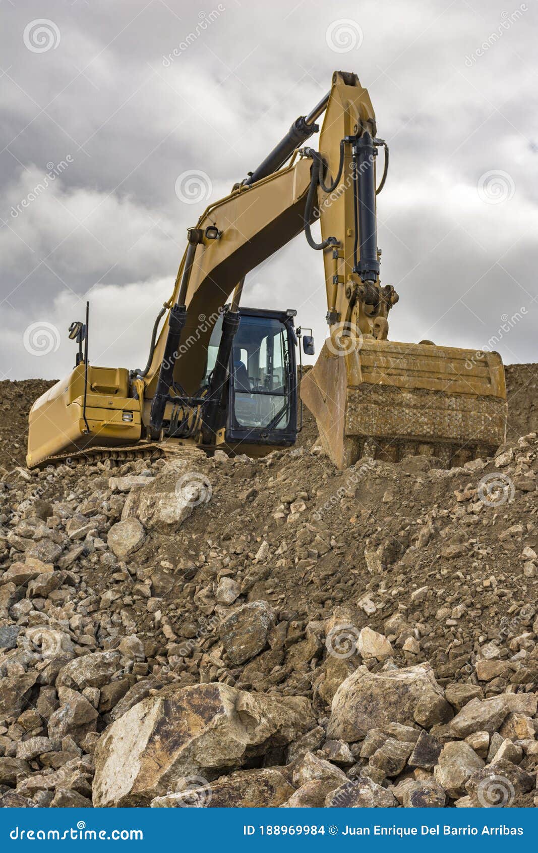 An Excavator Moves Stone and Rock in a Quarry Stock Photo - Image of ...
