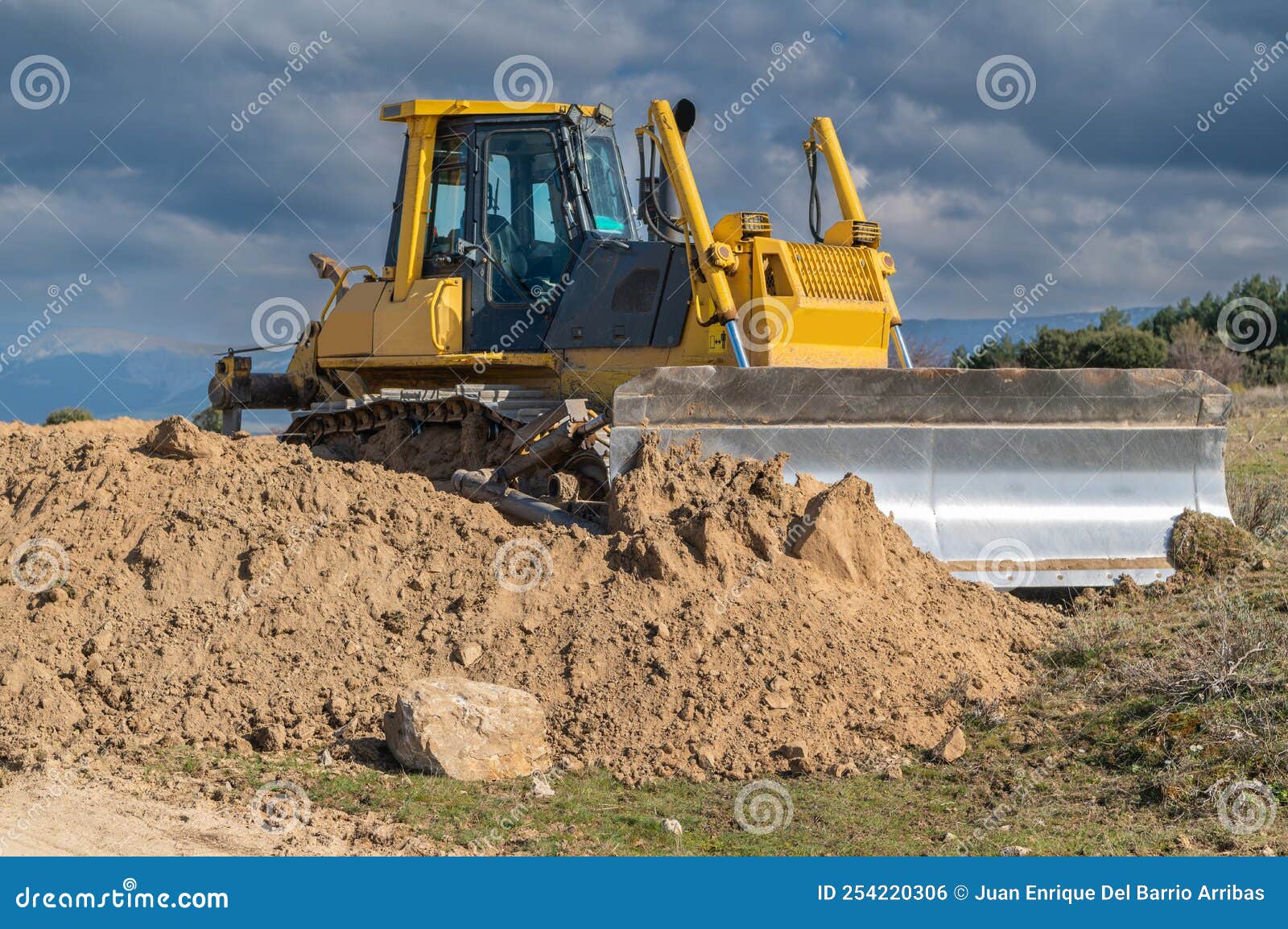 Excavator Moving Dirt and Sand at a Construction Site. Stock Photo ...