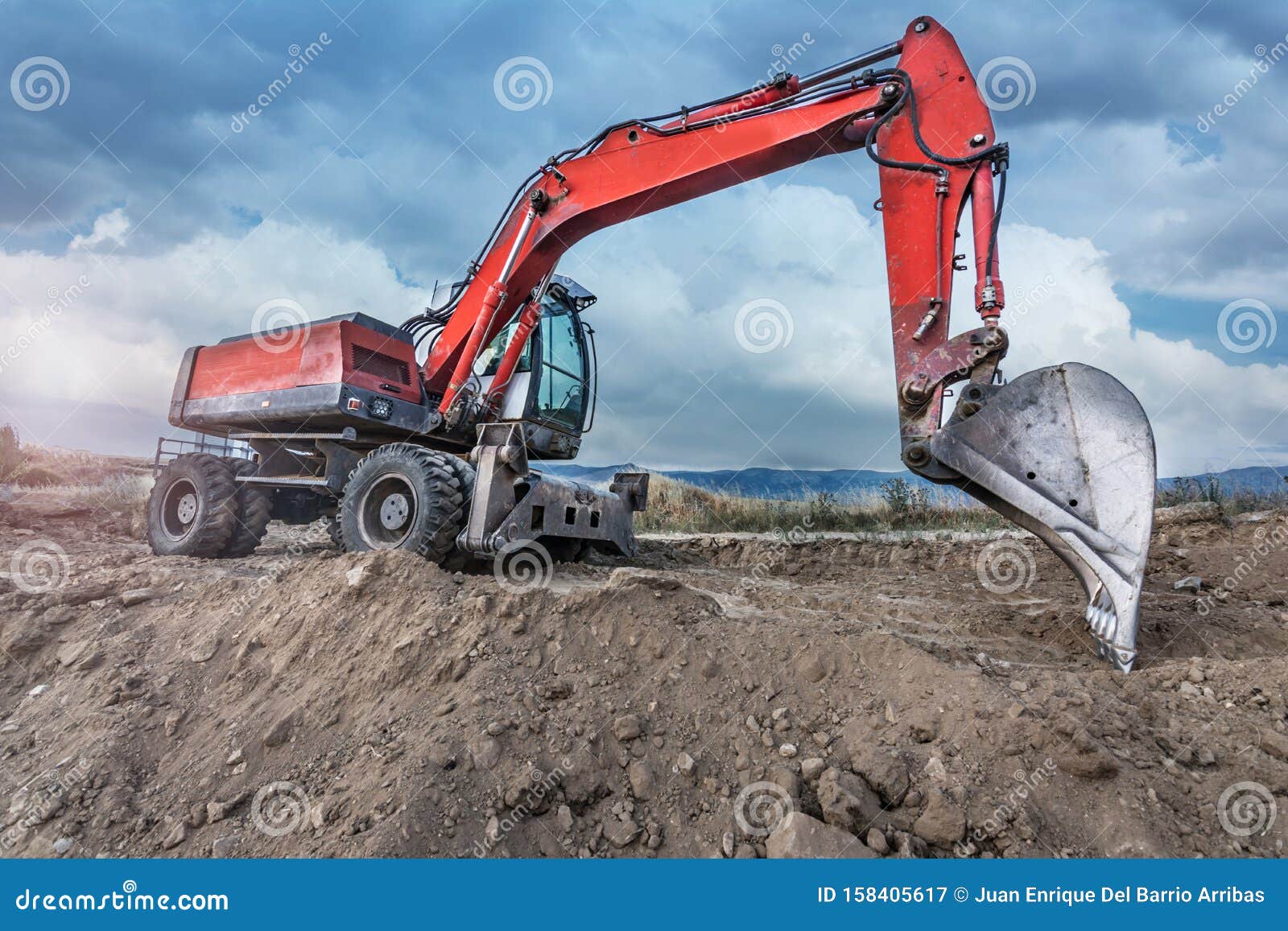 Excavator Moving Earth at the Beginning of a Work Stock Image - Image ...
