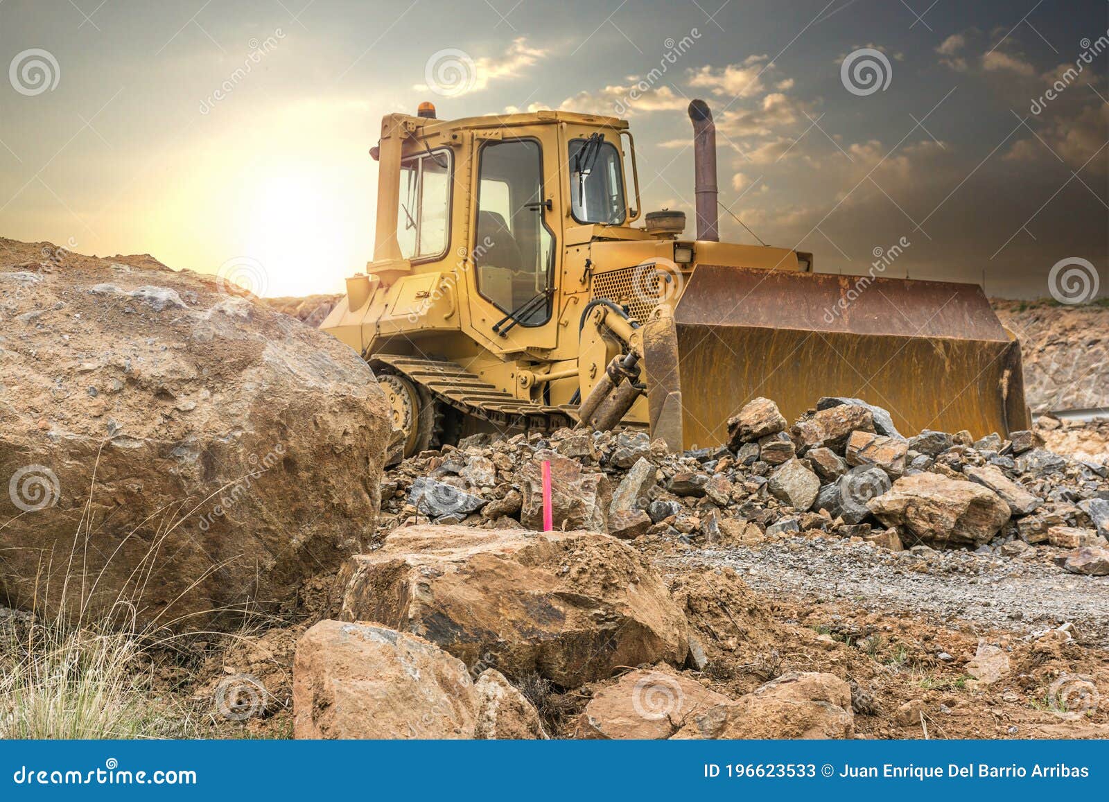 Excavator Moving Rocks on a Road Construction Site Stock Image - Image ...