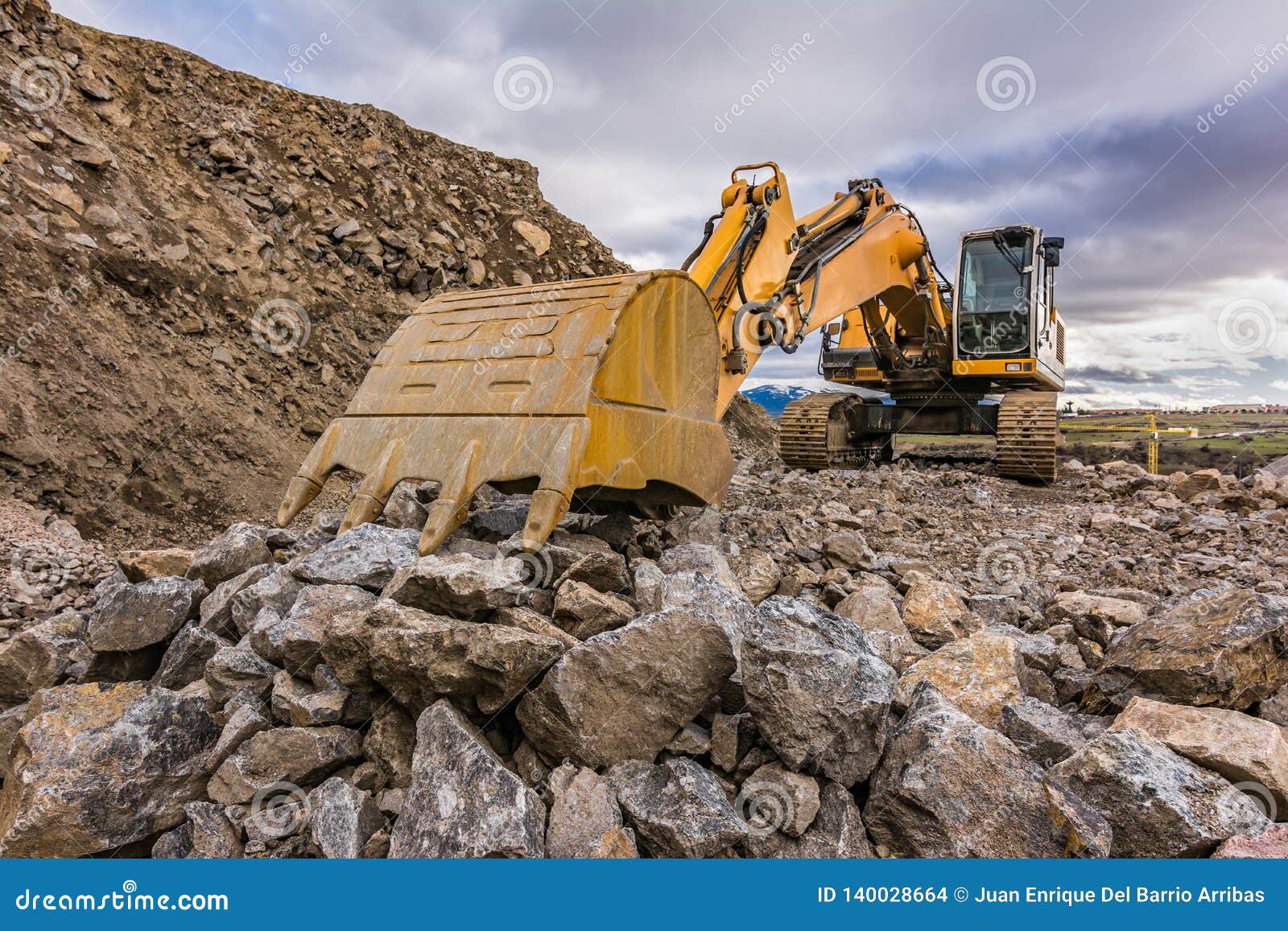 Excavator Moving Rocks on a Site for Processing and Transformation ...