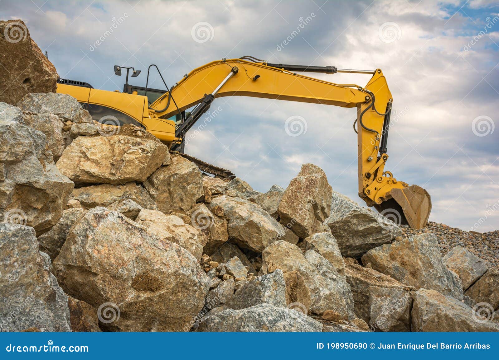 Excavator Moving Stones and Rock in a Quarry Stock Photo - Image of ...