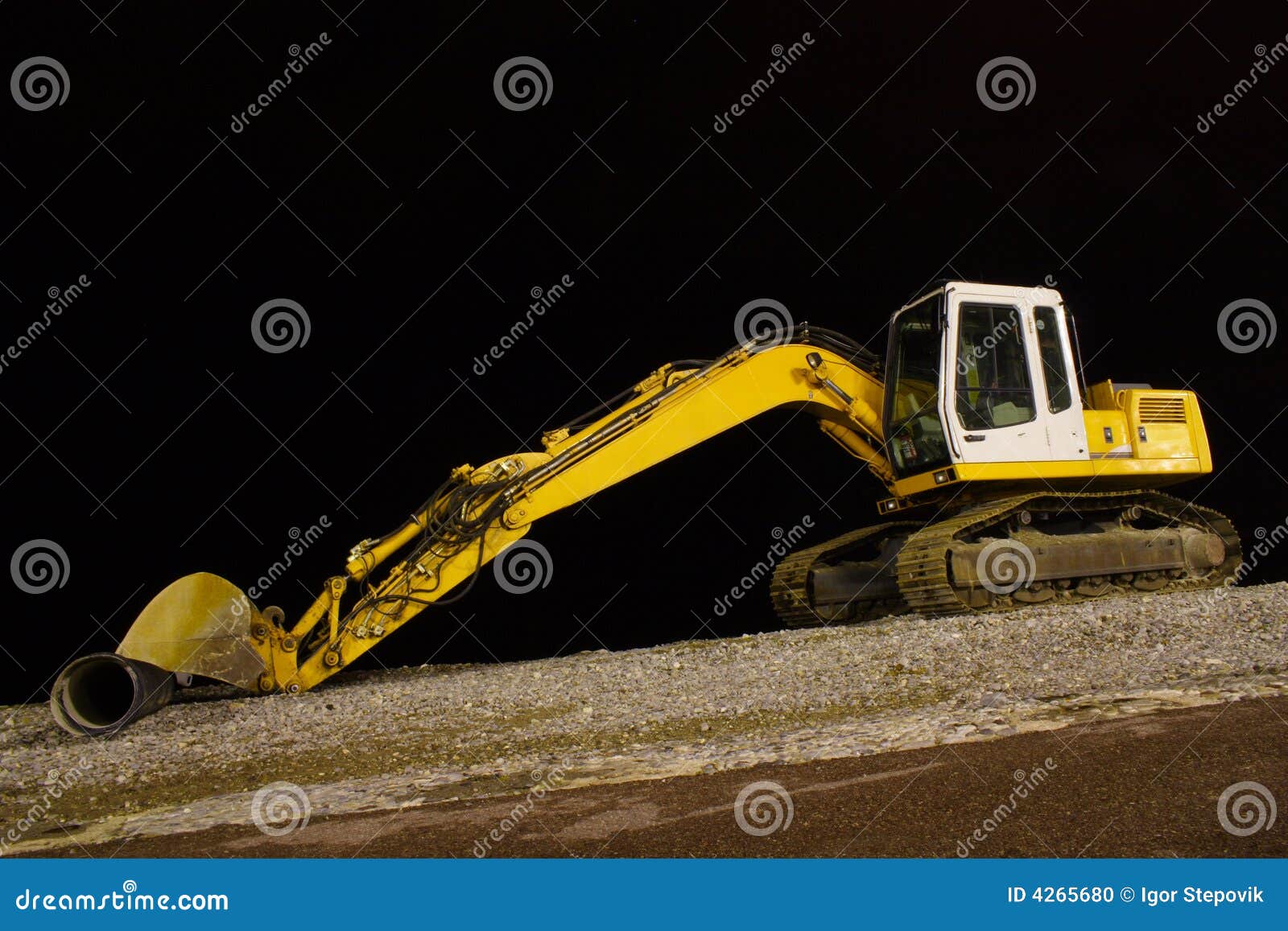 Excavator on Night Pebble Beach Stock Photo - Image of industrial ...