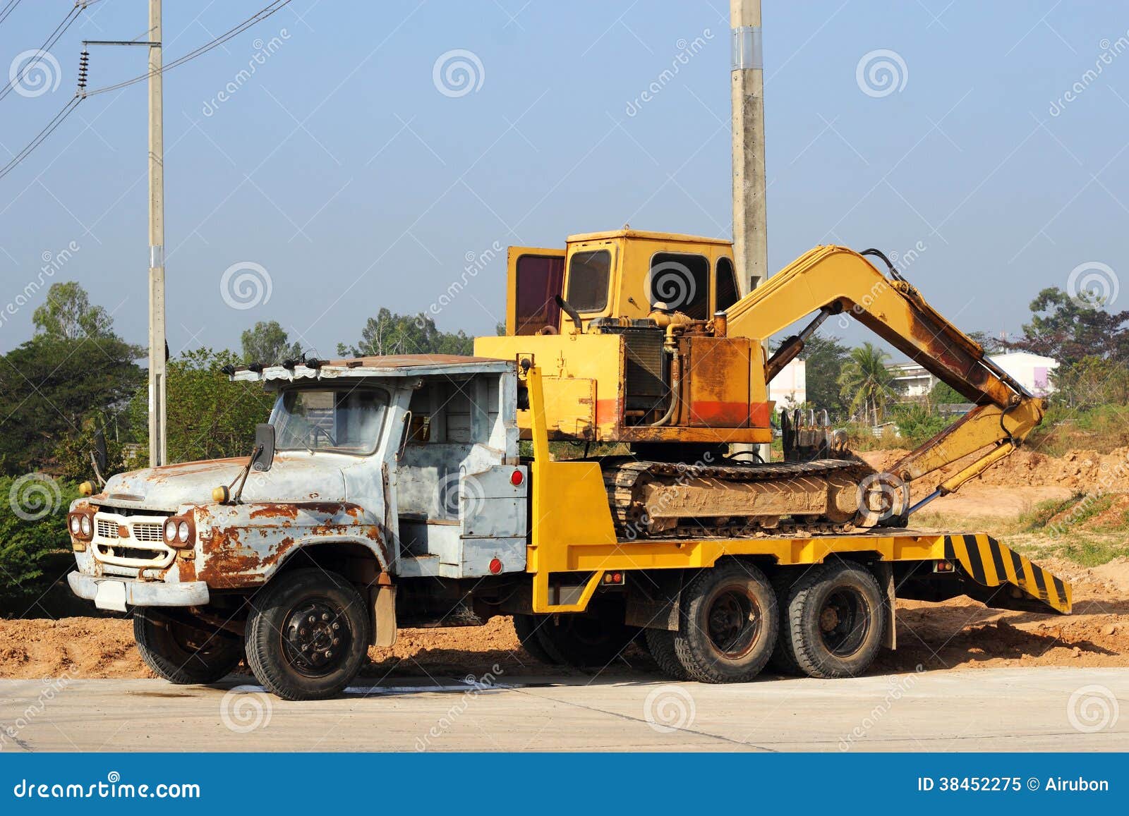 Excavator on old truck stock image. Image of caterpillar - 38452275