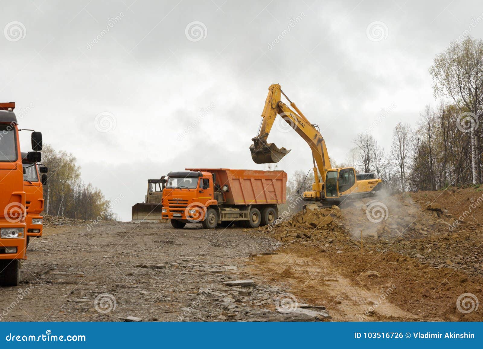 Excavator in operation editorial photo. Image of cloudy - 103516726