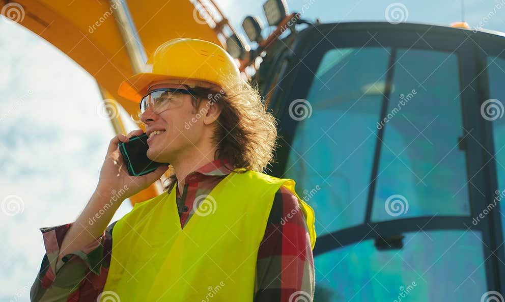 Excavator Operator in Hard Hat Stock Image - Image of earthmover, phone ...