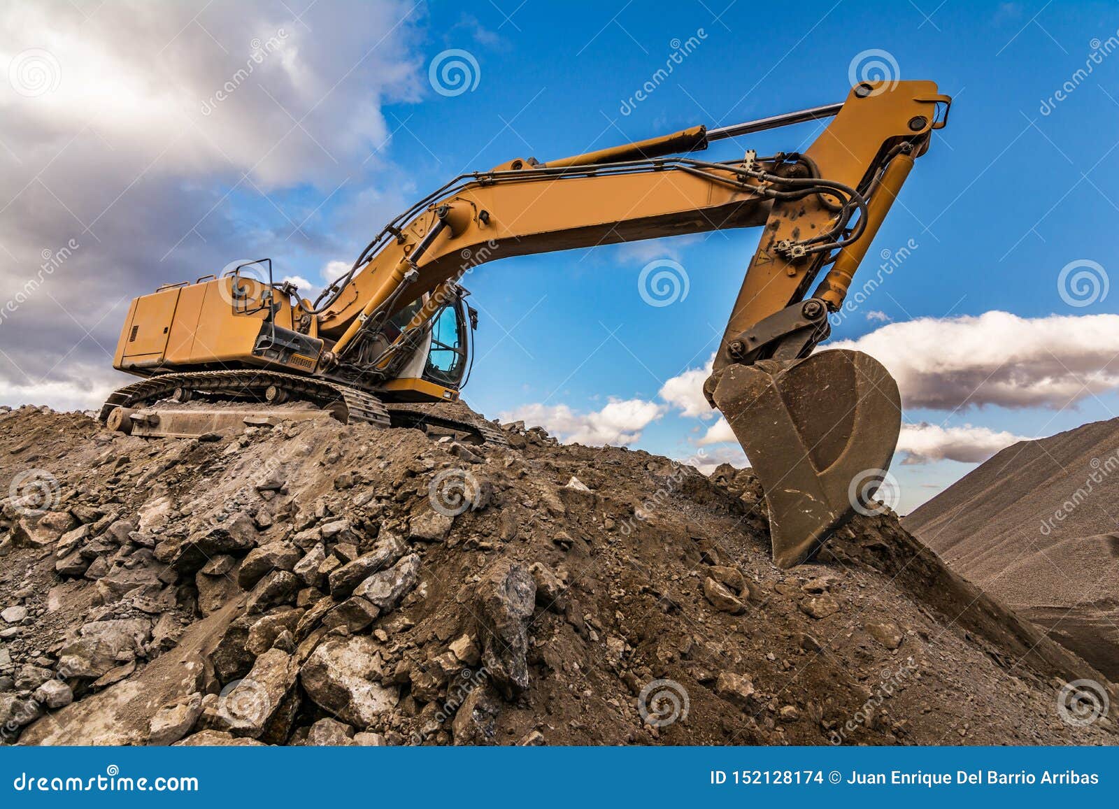 Excavator Performing Stone Extraction Work in an Open Pit Stone Mine ...