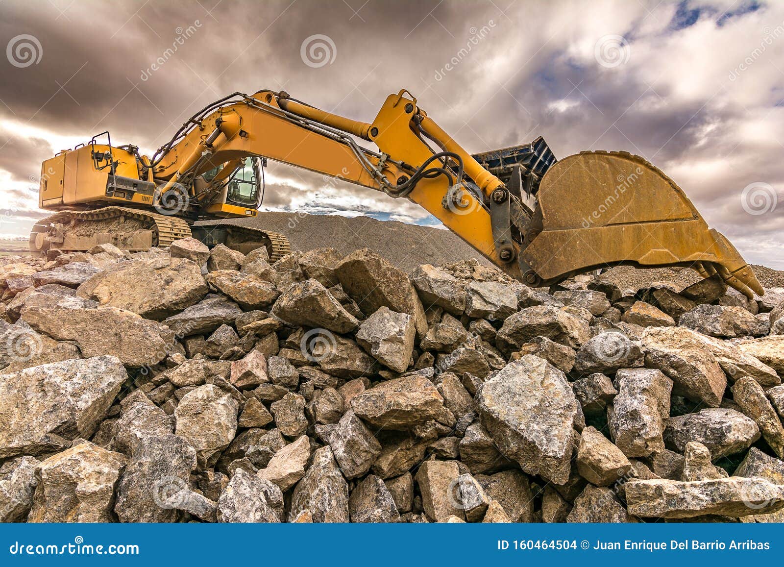 Excavator Performing Stone Extraction Work in an Open Pit Stone Mine ...