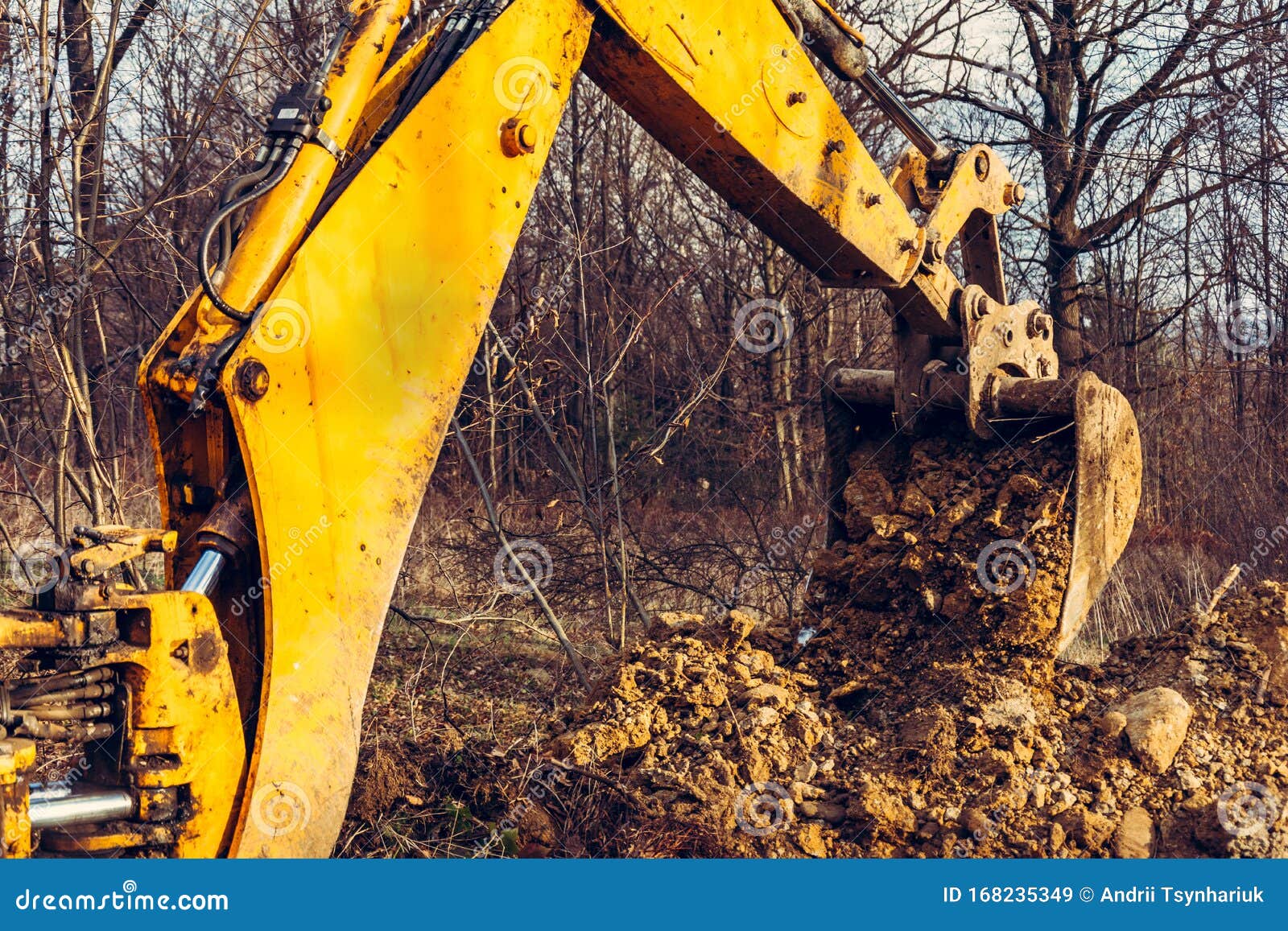The Excavator Performs Excavation Work by Digging the Ground with a ...