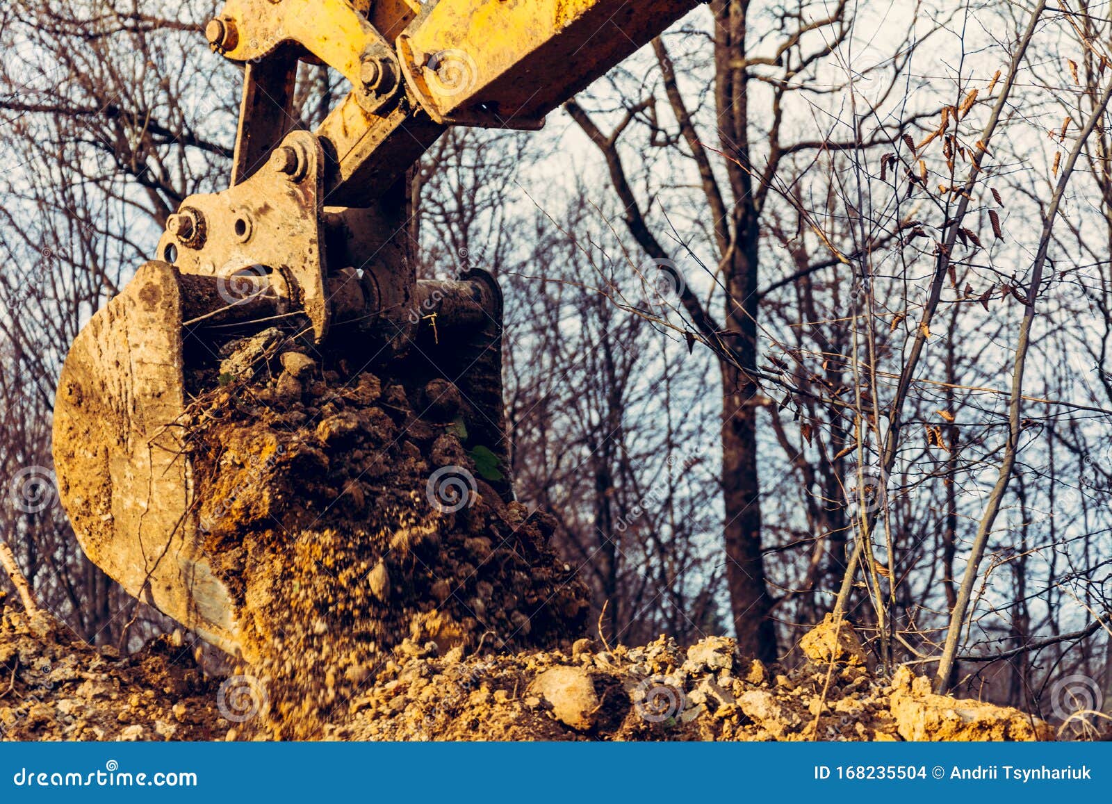 The Excavator Performs Excavation Work by Digging the Ground with a ...