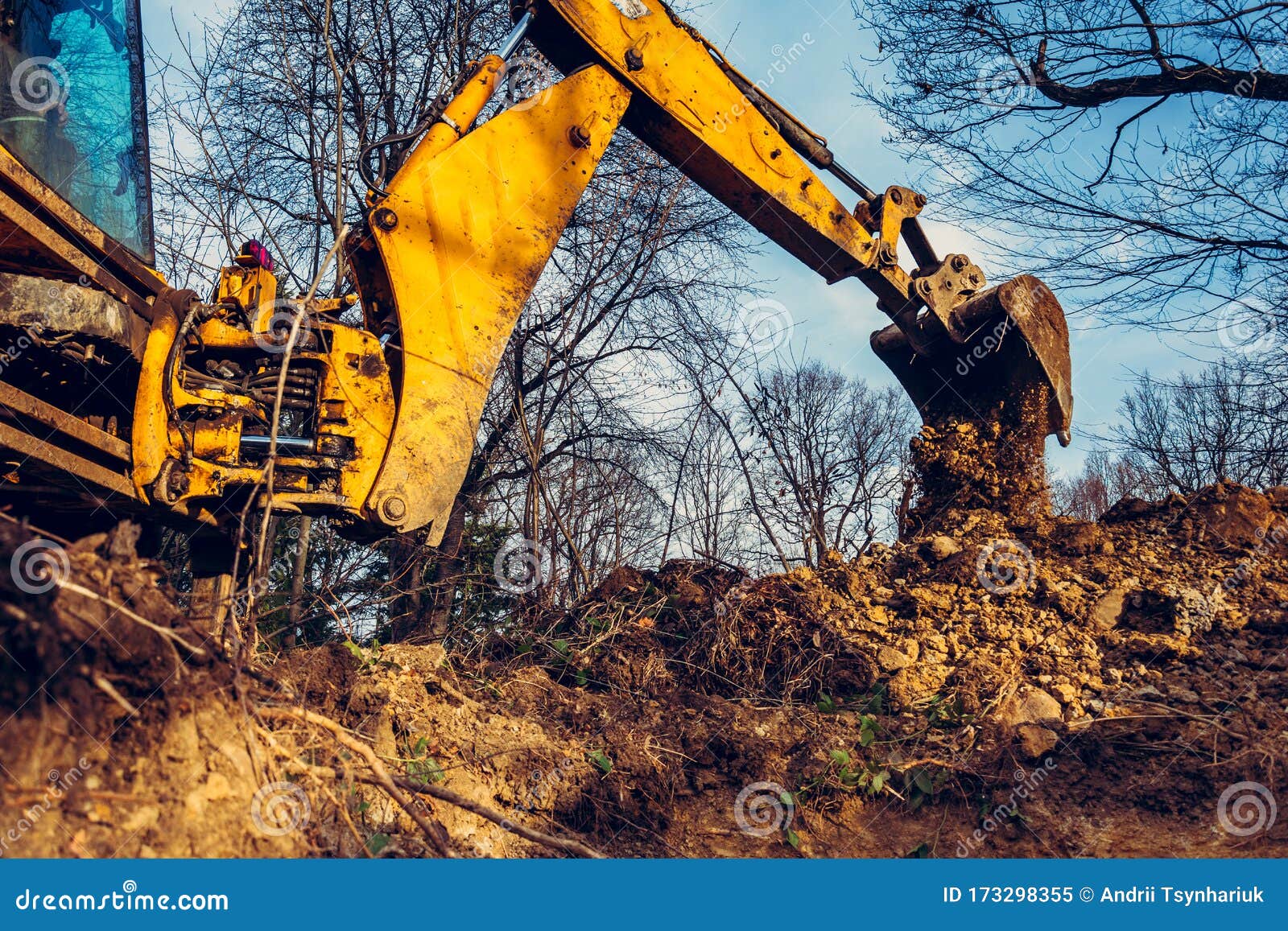 The Excavator Performs Excavation Work by Digging the Ground with a ...