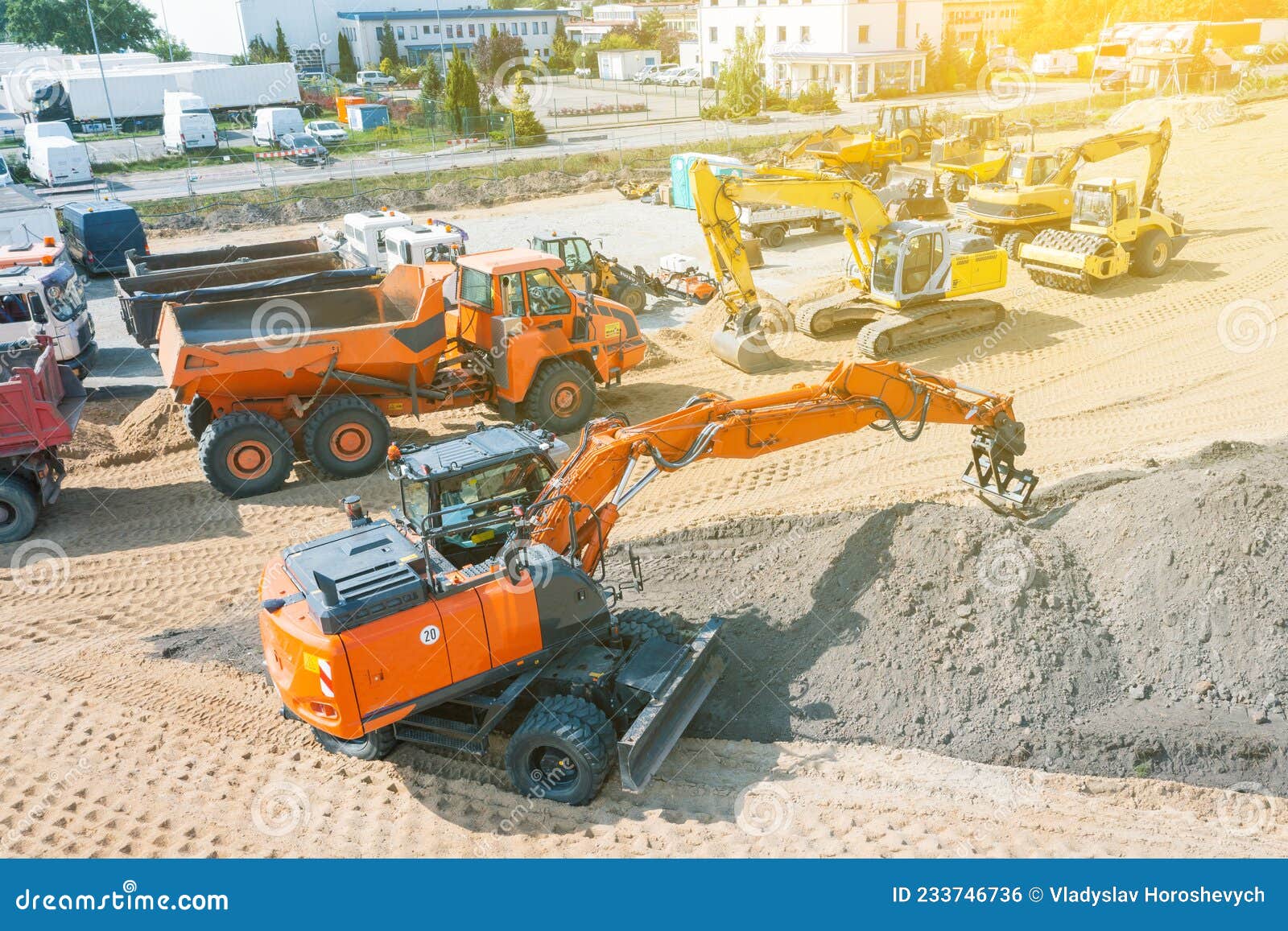 Excavator Plans Land at Construction Site, Excavator Digs Trenches ...