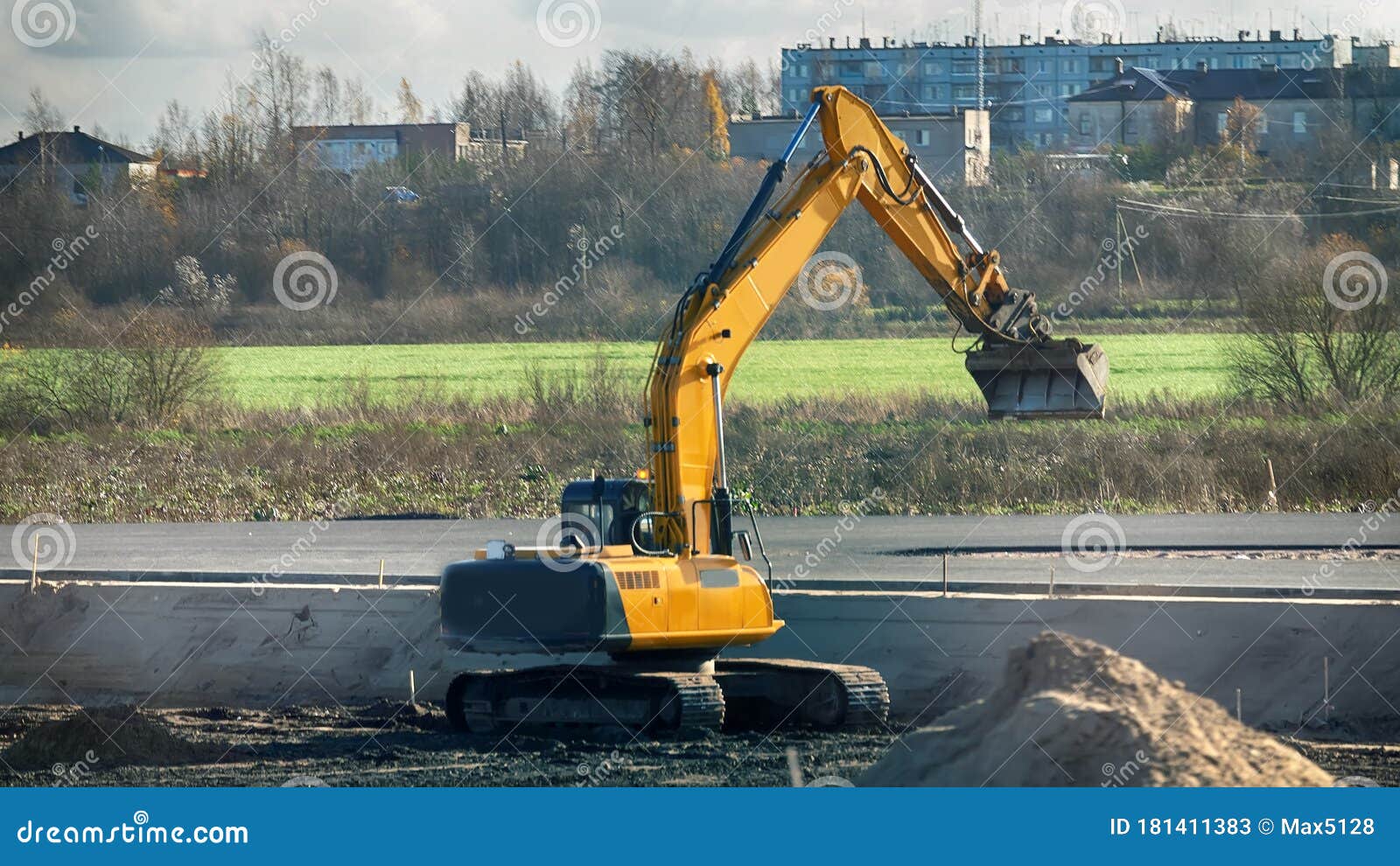 Excavator in the Process of Leveling the Slope of the Road Stock Image ...