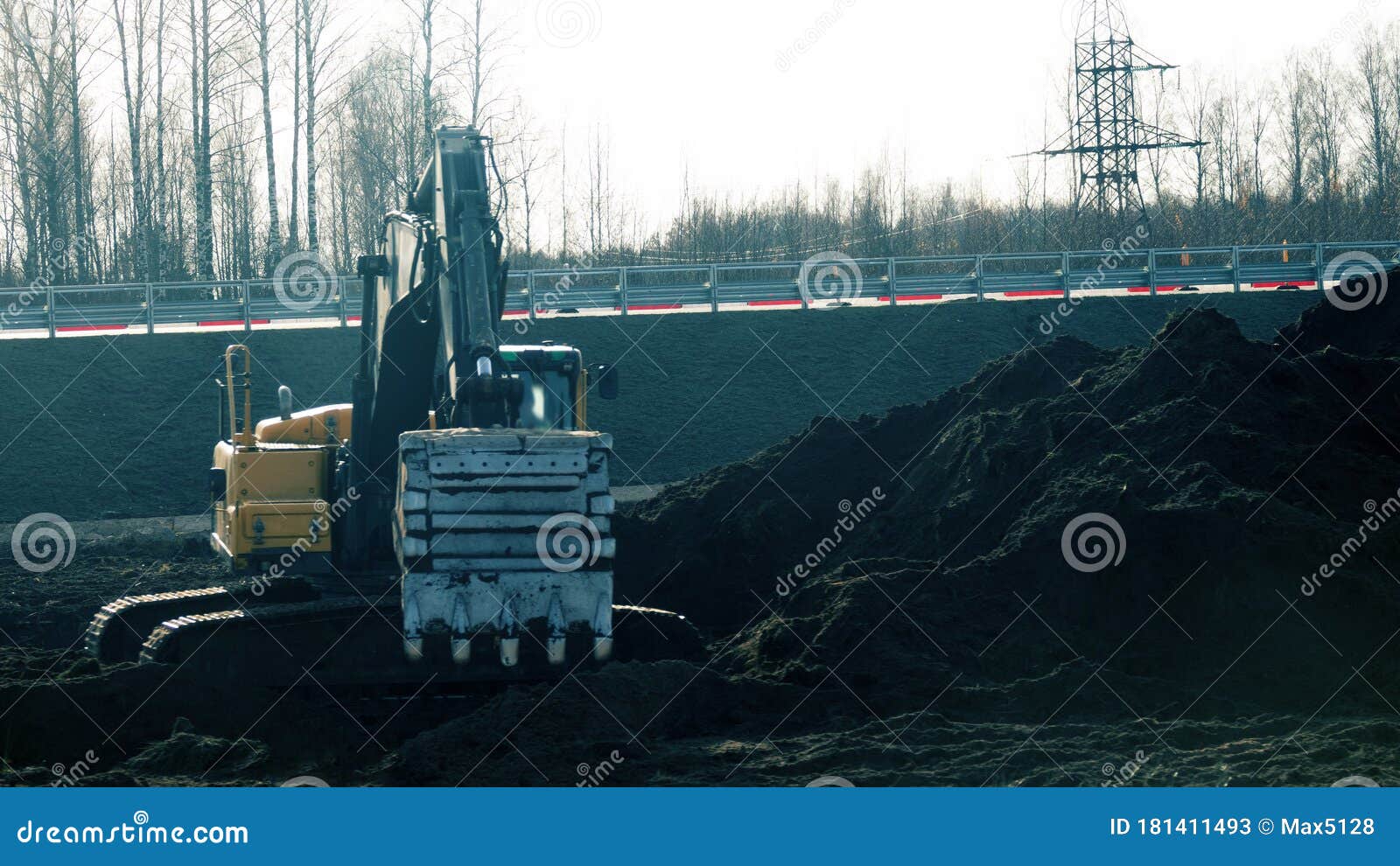 Excavator in the Process of Leveling the Slope of the Road Stock Image ...