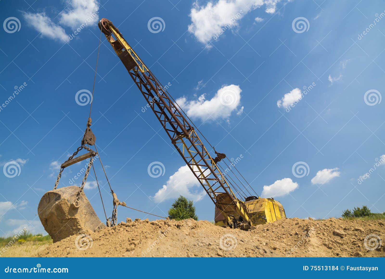 Excavator produces clay stock photo. Image of industry - 75513184