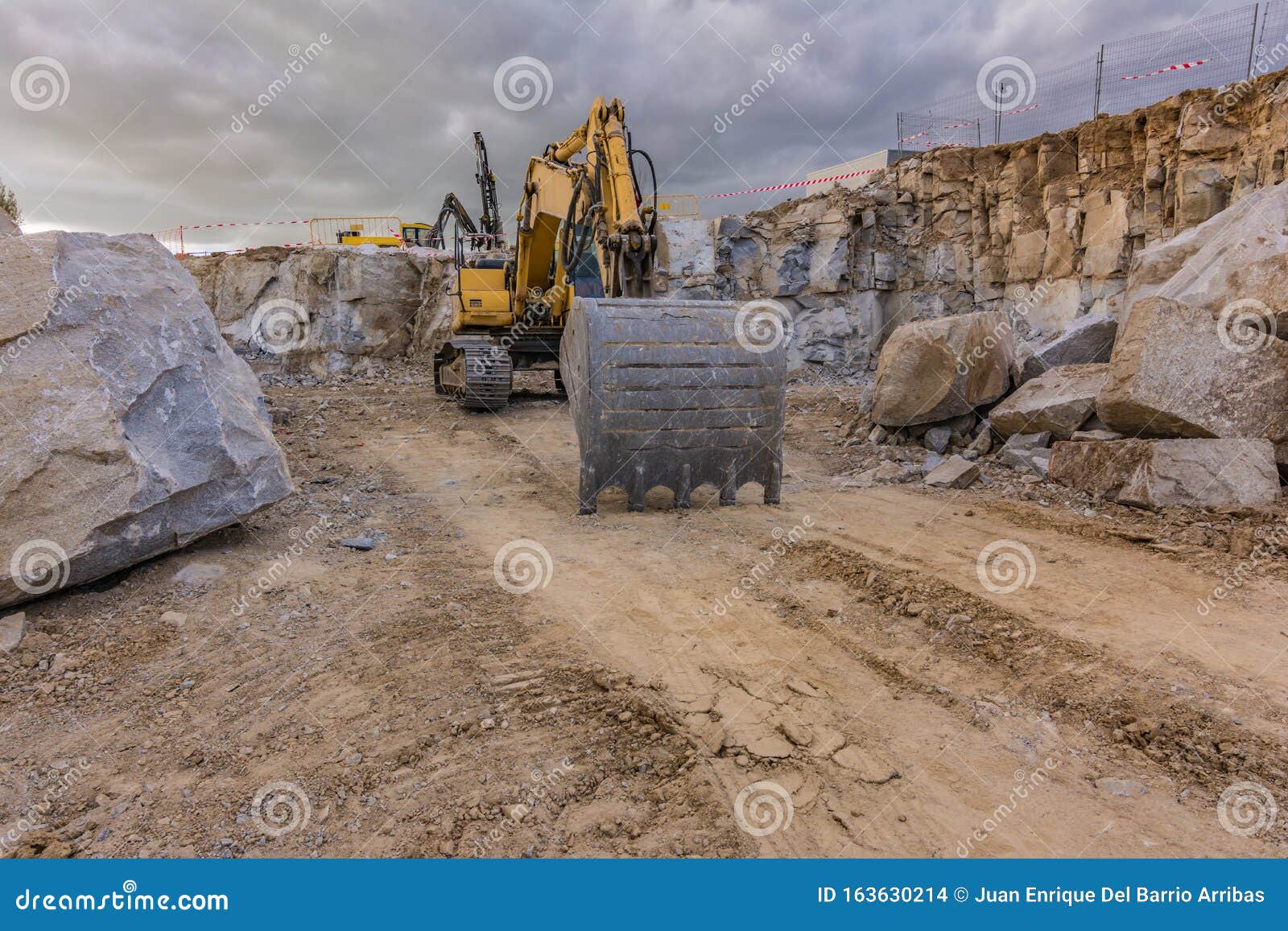 Excavator in a Quarry Extracting Stone Stock Photo - Image of excavator ...